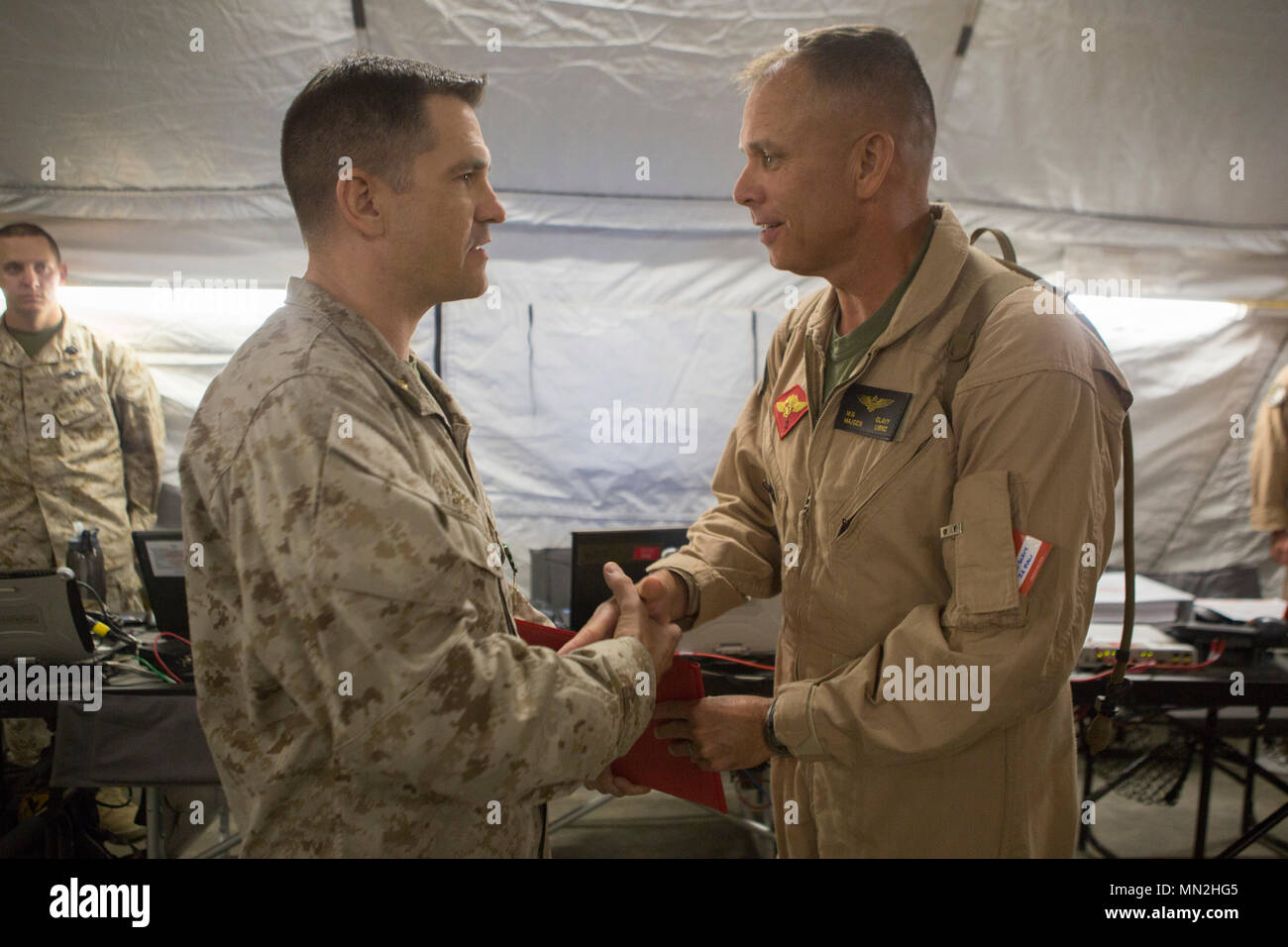 U.S. Marine Corps Maj. Matthew Sproat, left, future operations officer ...