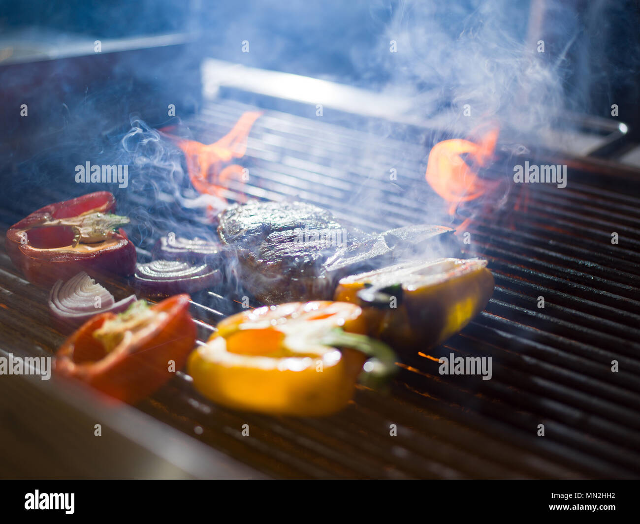 delicious grilled meat steak with vegetables on a barbecue Stock Photo ...