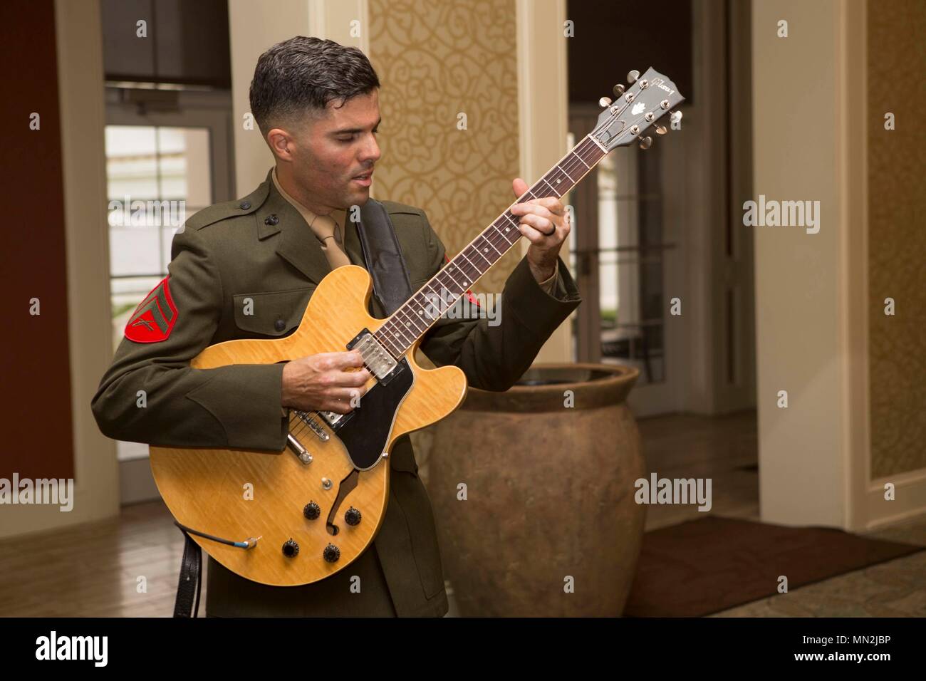 U.S. Marine Corps Cpl. Sean Healey, guitarist with the jazz combo, 2nd ...