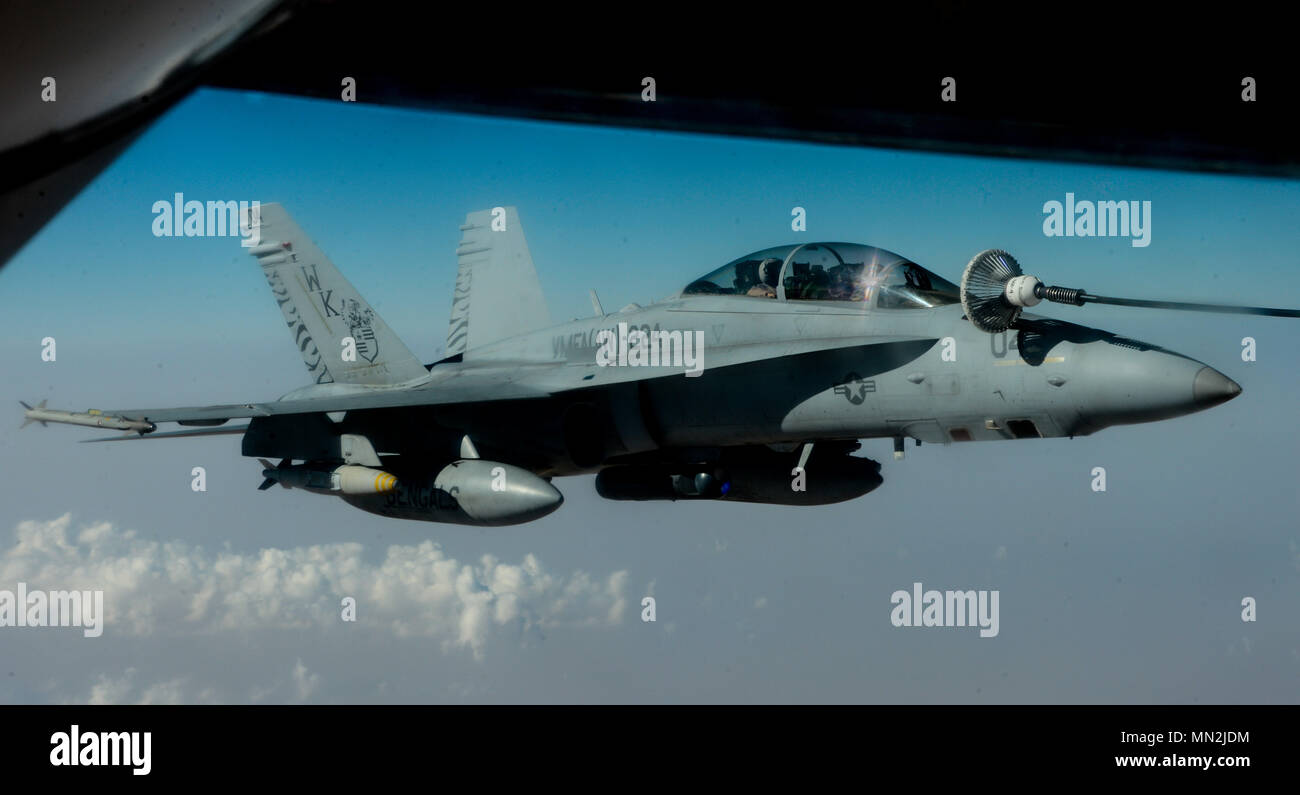 A U.S. Marine F/A-18 Hornet receives fuel from a KC-135 Stratotanker ...