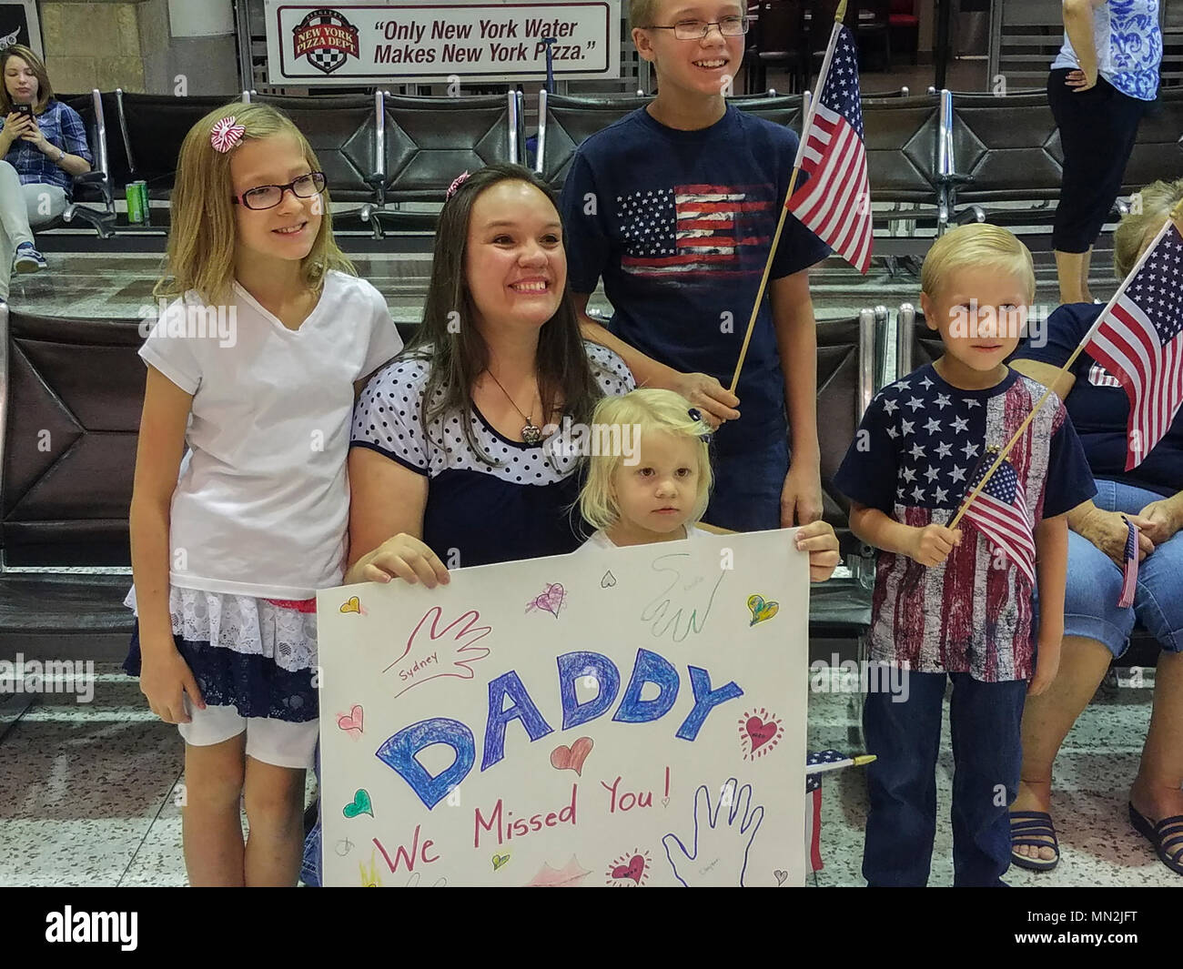 The McKane family waits for Staff Sgt. David McKane upon the 159th ...