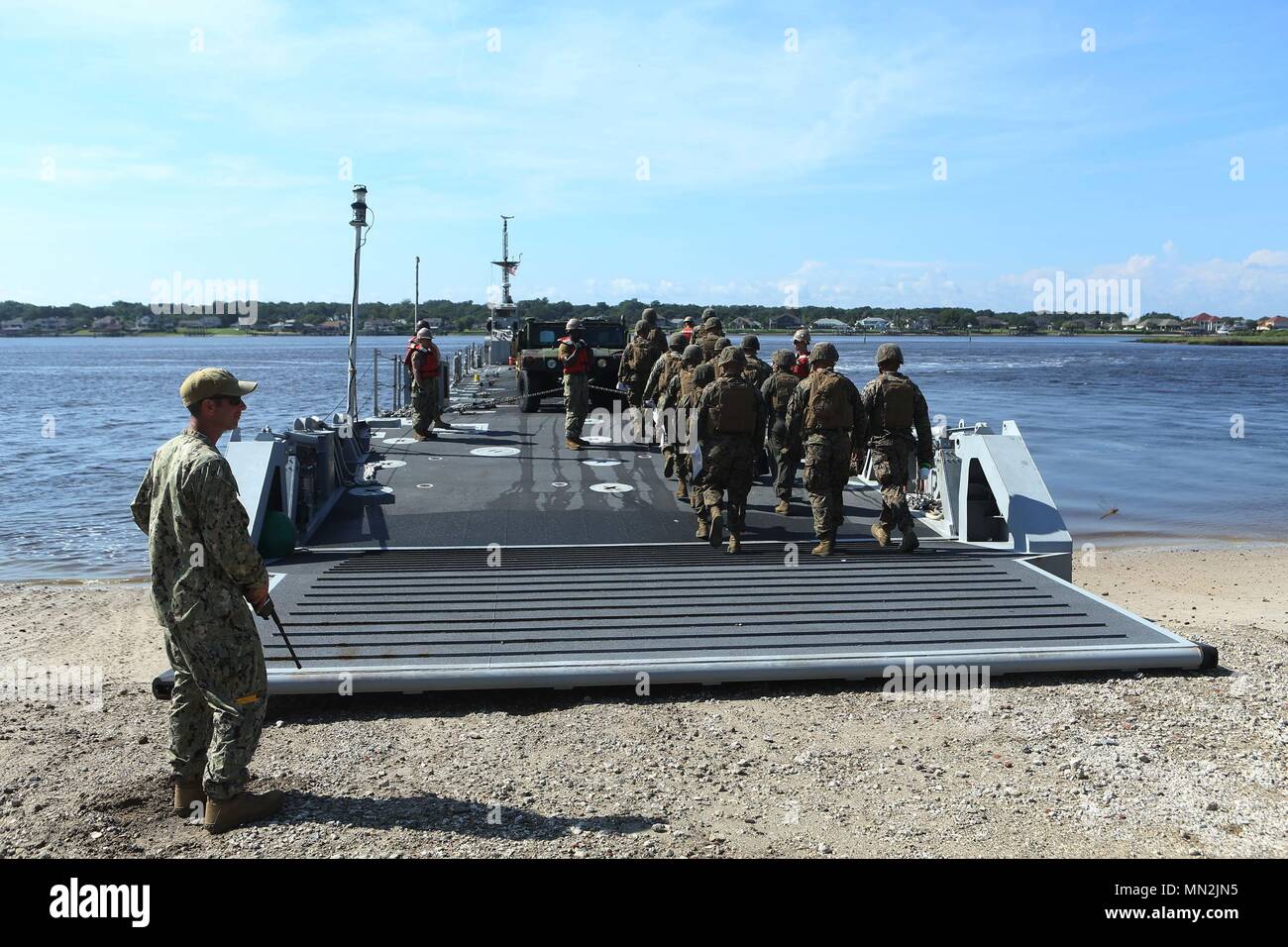 U.S. Marines and Sailors with 2nd Marine Logistics Group, prepare to ...