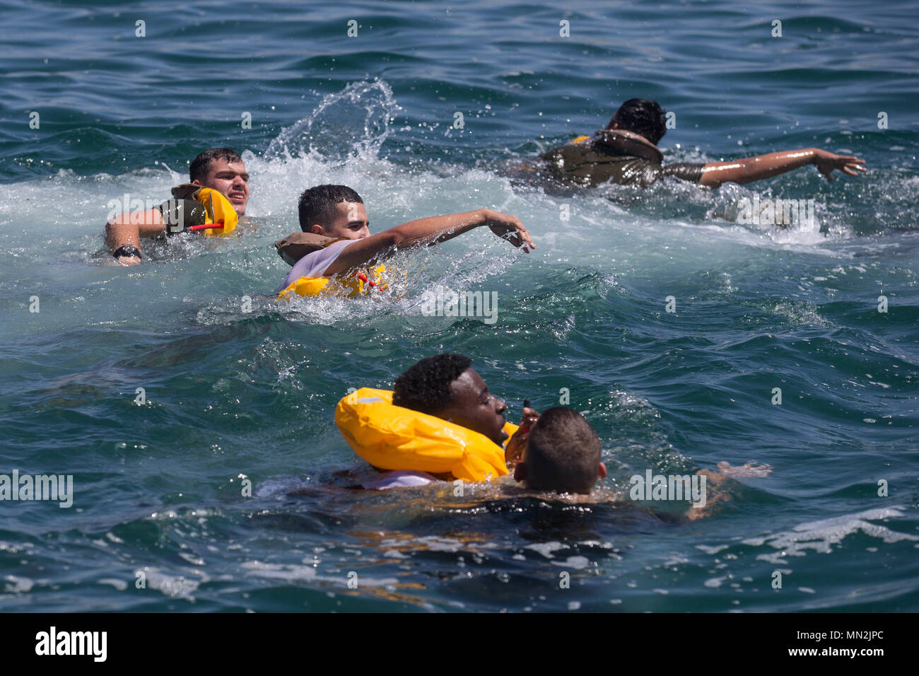 U.S. Marines with 3rd Assault Amphibian Battalion, swim during their ...