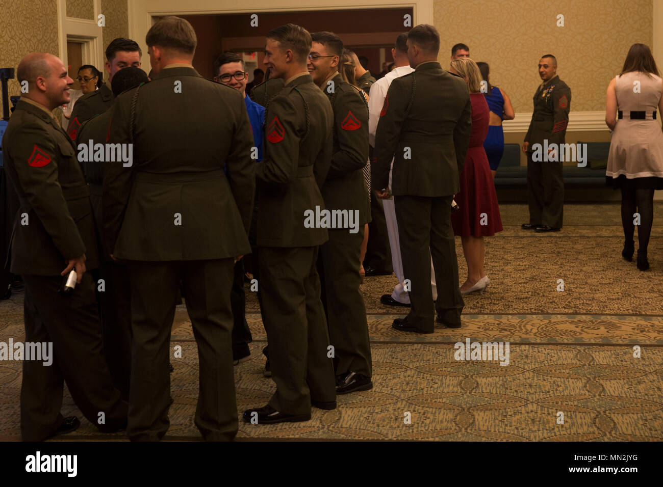 Attendees interact with each other before the anniversary dinner for ...