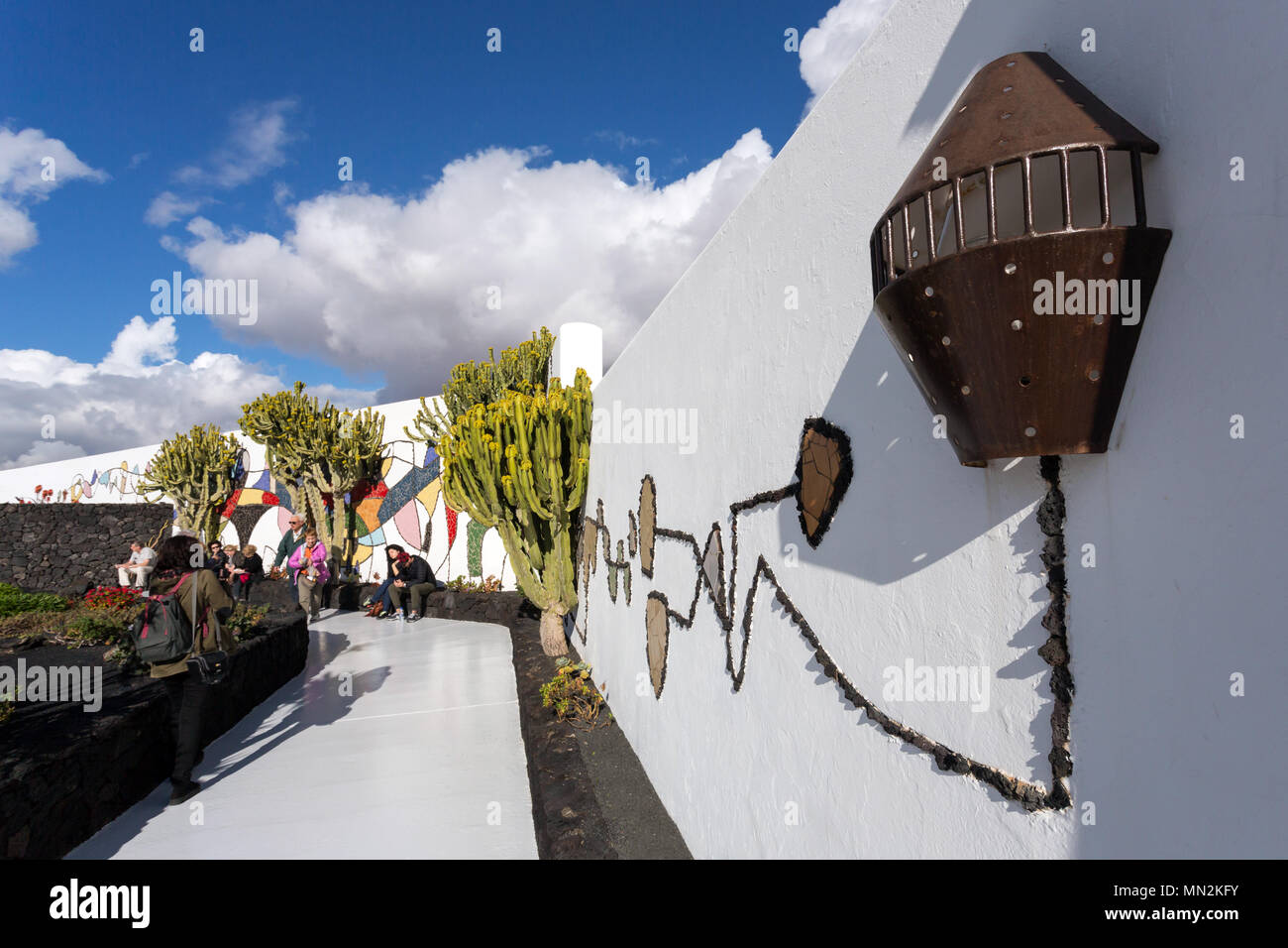 TAHICHE, LANZAROTE, CANARY ISLANDS, SPAIN: Tourist resting in the sun ...