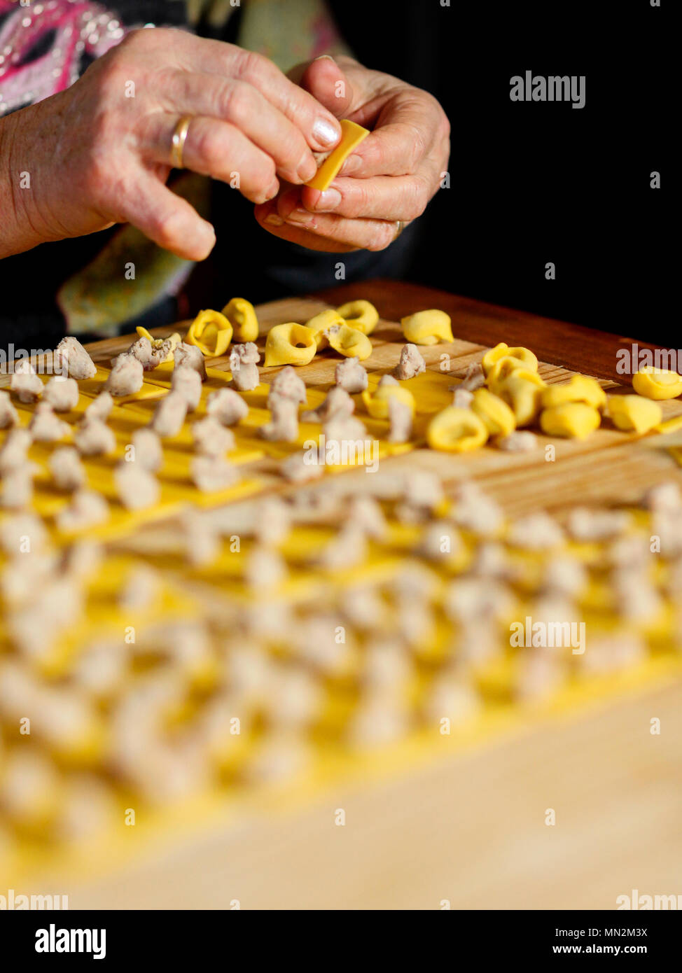 Tortellini, preparation of the traditional home made pasta of Modena ...