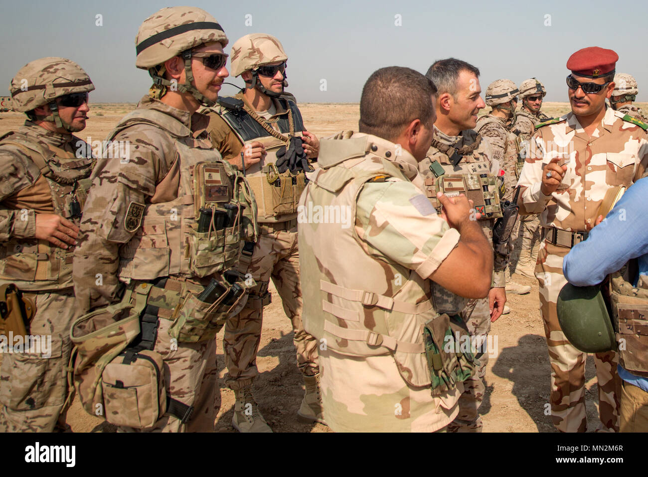 A Spanish army officer speaks with an Iraqi security forces officer ...