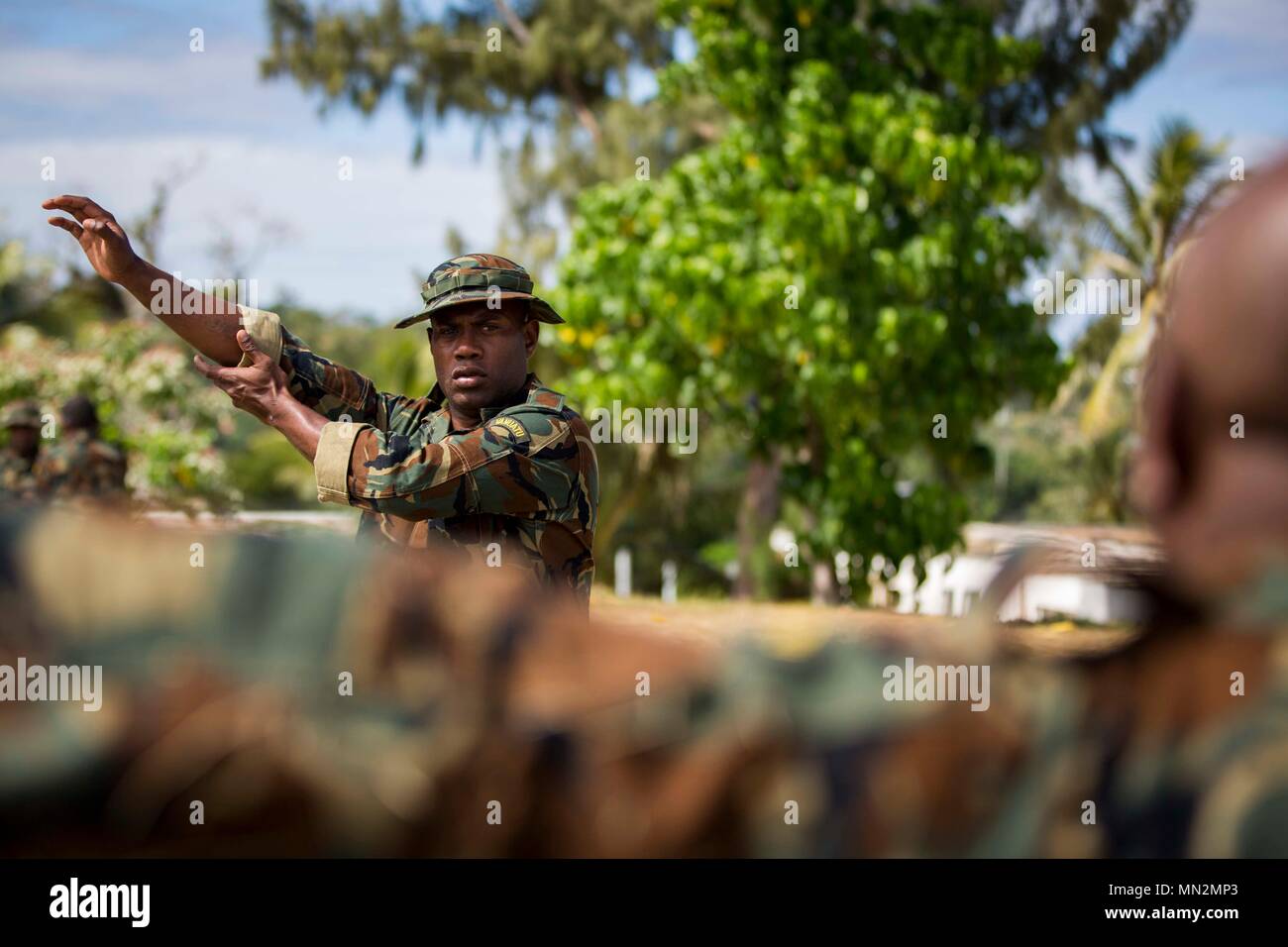 Members of the Vanuatu Police Force practice searching procedures ...