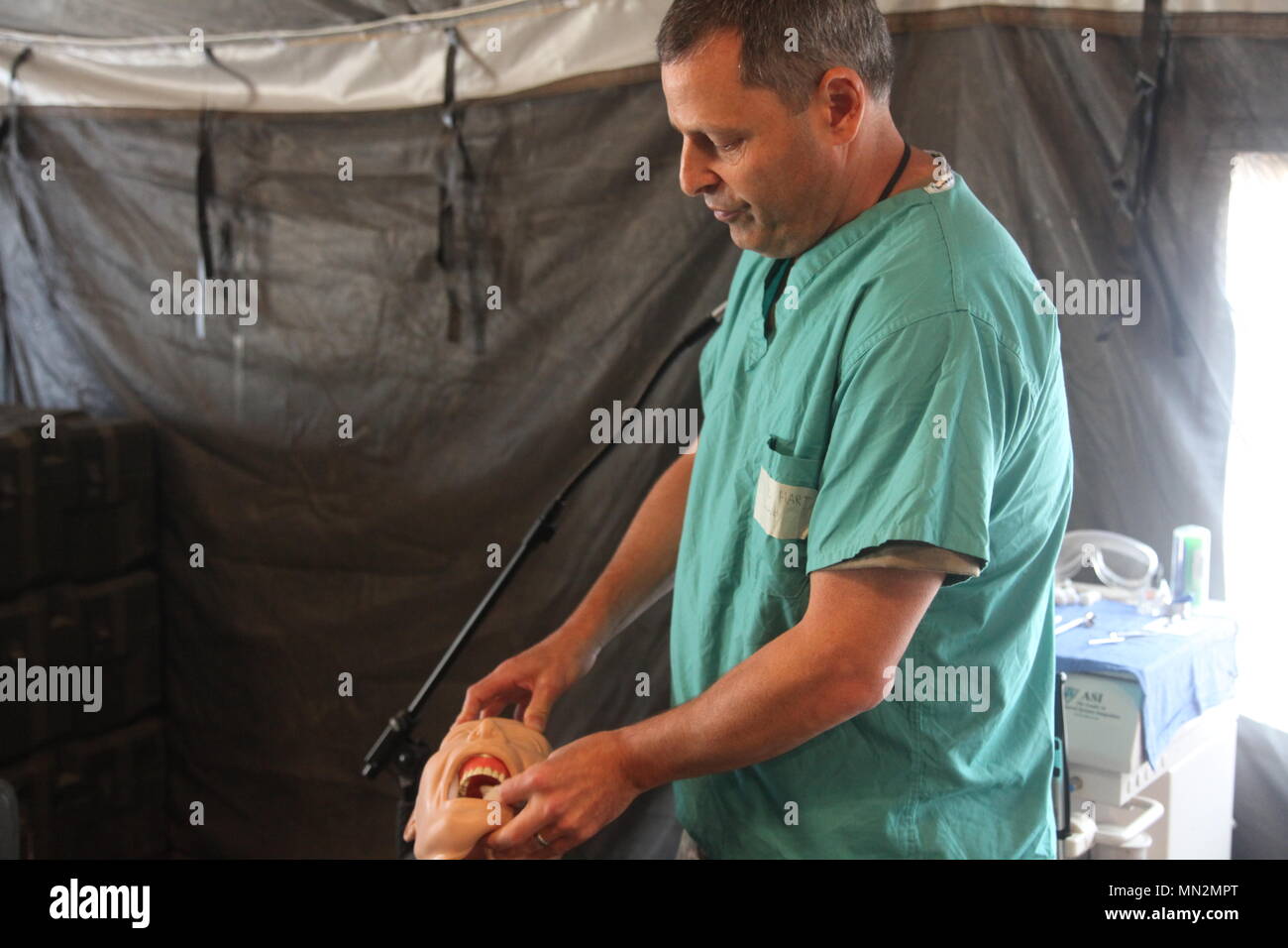 U.S. Army Lt. Col. Evan Hart of the 143rd Dental Company, 328 Battalion ...