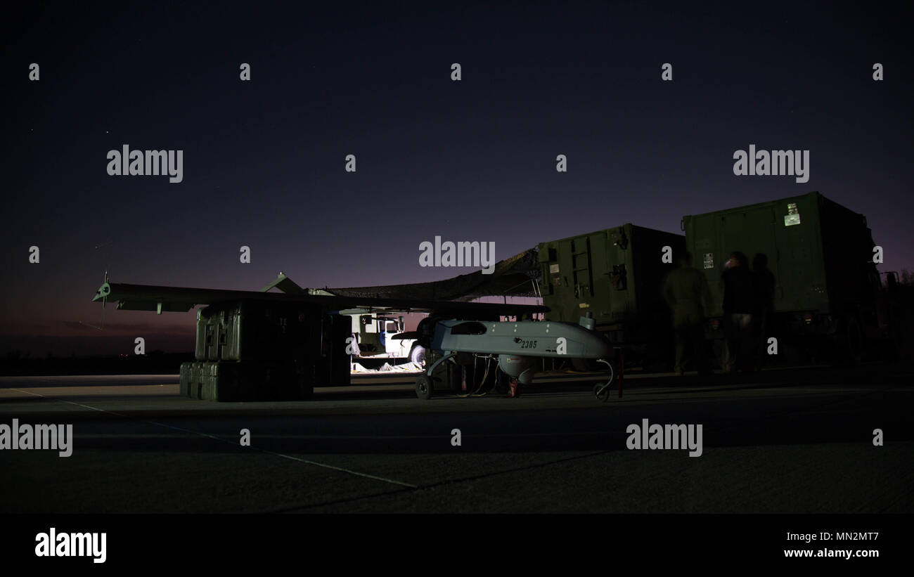 An RQ-7 Shadow Tactical Unmanned Aircraft System waits to be assembled ...