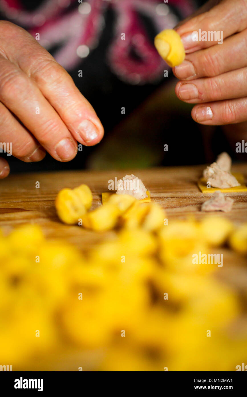 Tortellini, preparation of the traditional home made pasta of Modena ...