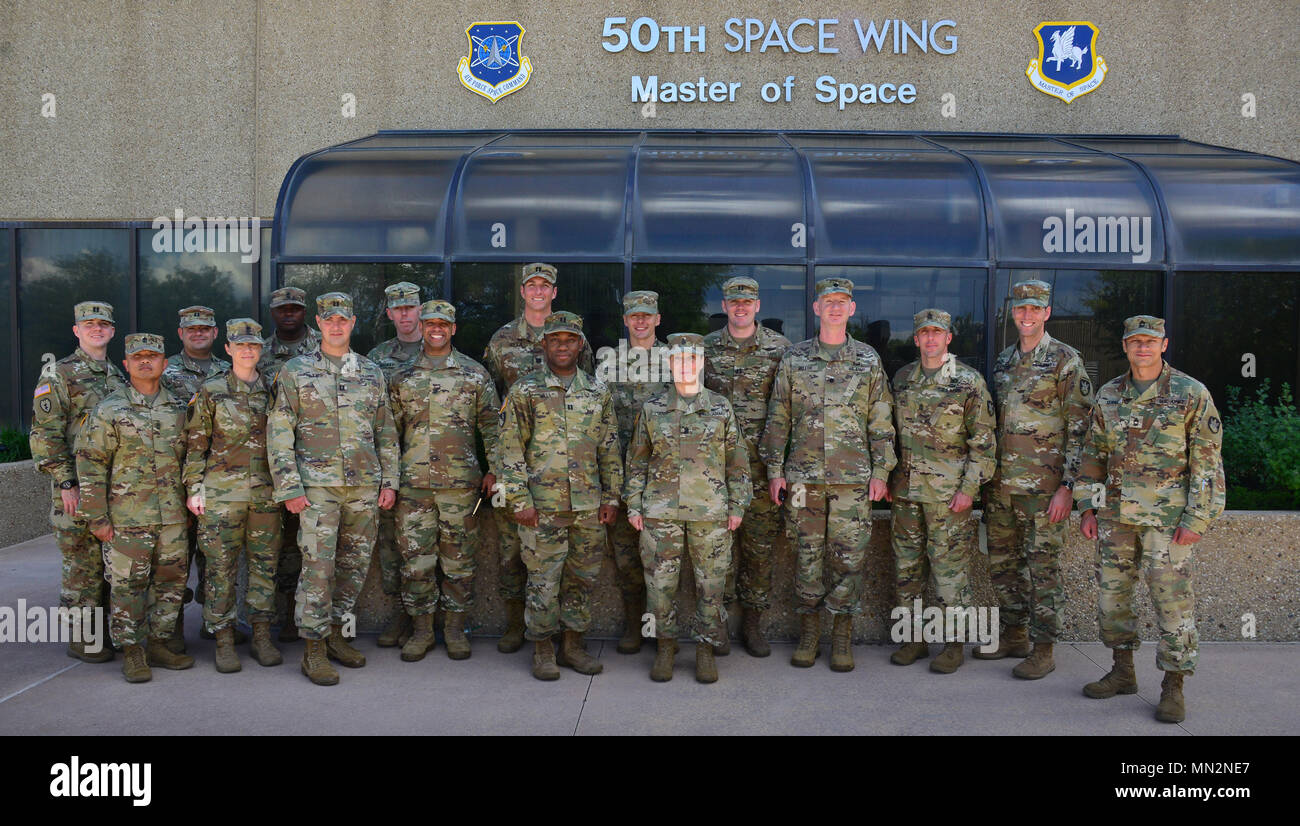 Members of the 53rd Signal Battalion gather for a photo at Schriever ...