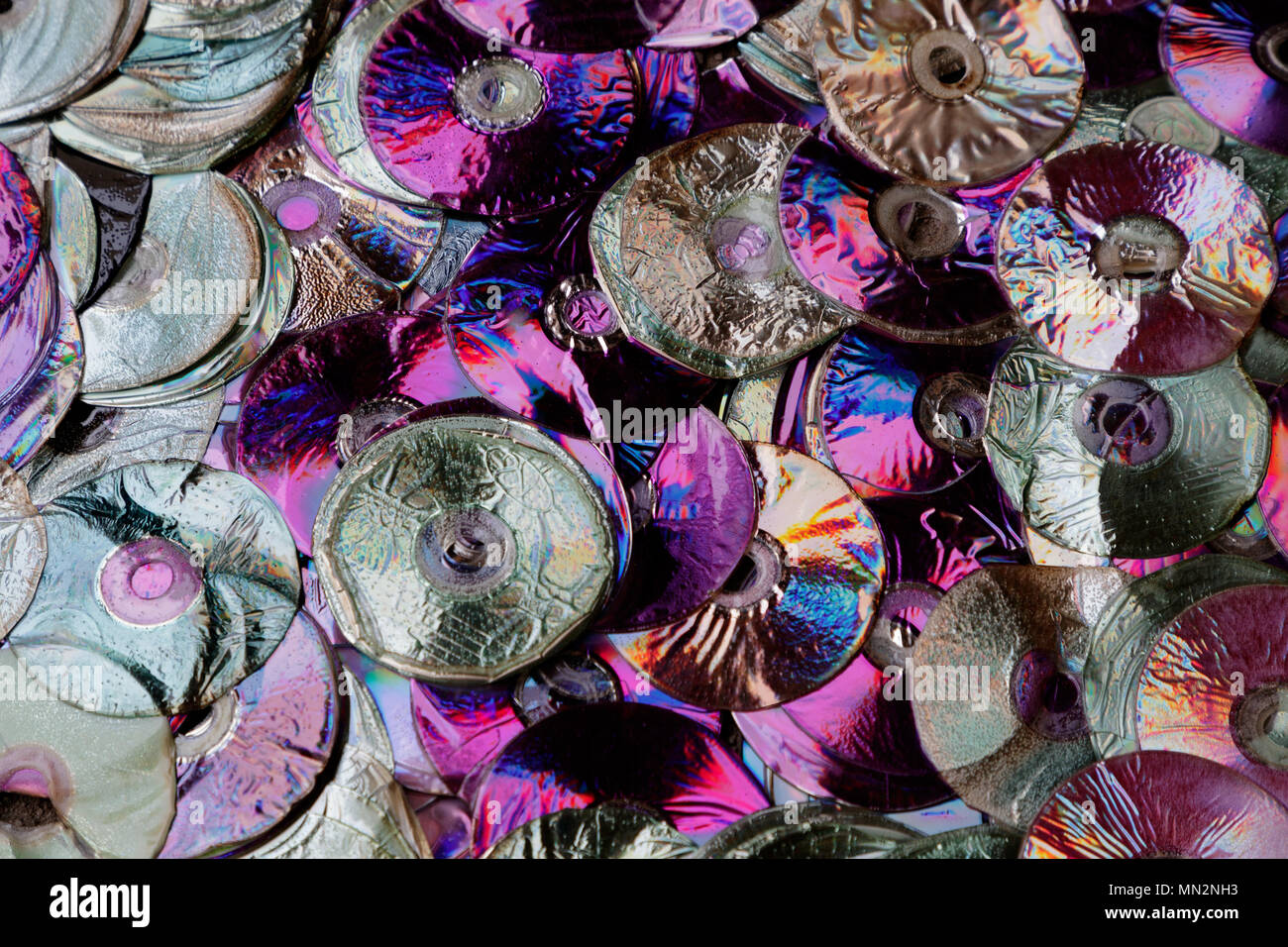 fused compact disk a lot of background Stock Photo - Alamy