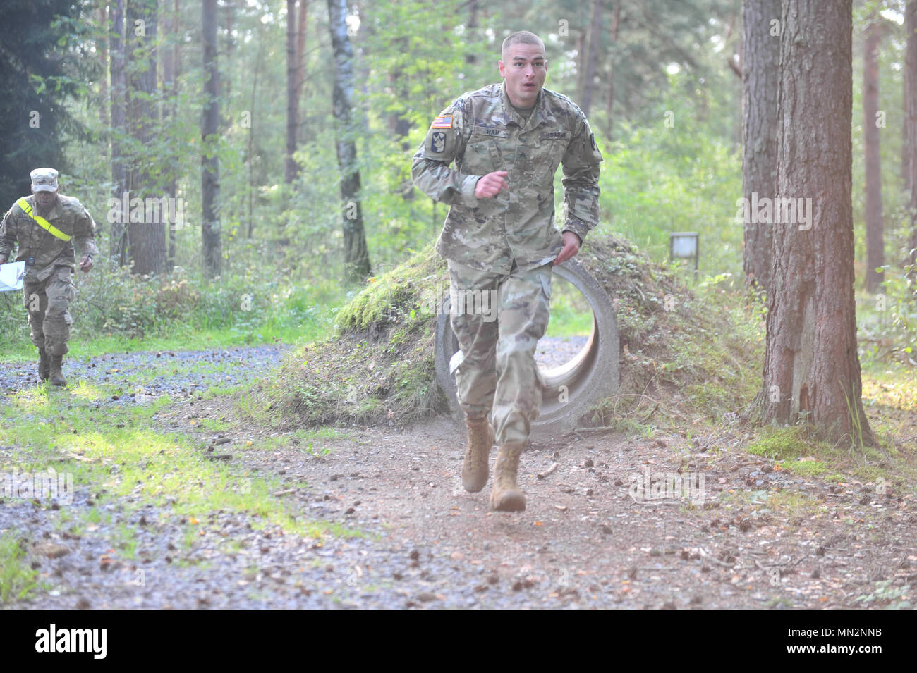 Sgt. Jacob Rau, 21st Theater Sustainment Command, runs to the next ...