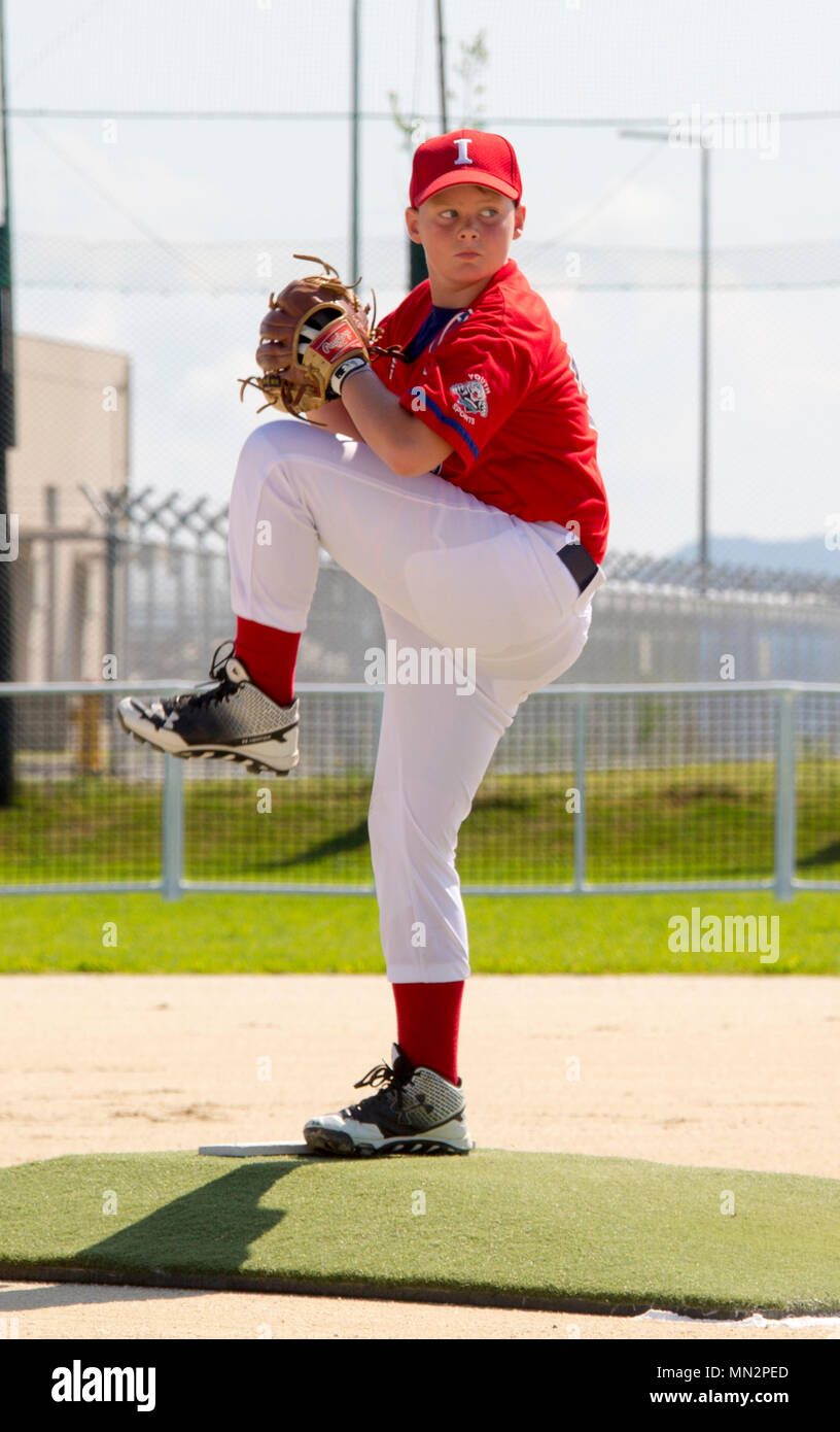 Ethan Kowalski, pitcher for the Iwakuni All Stars, begins to pitch ...