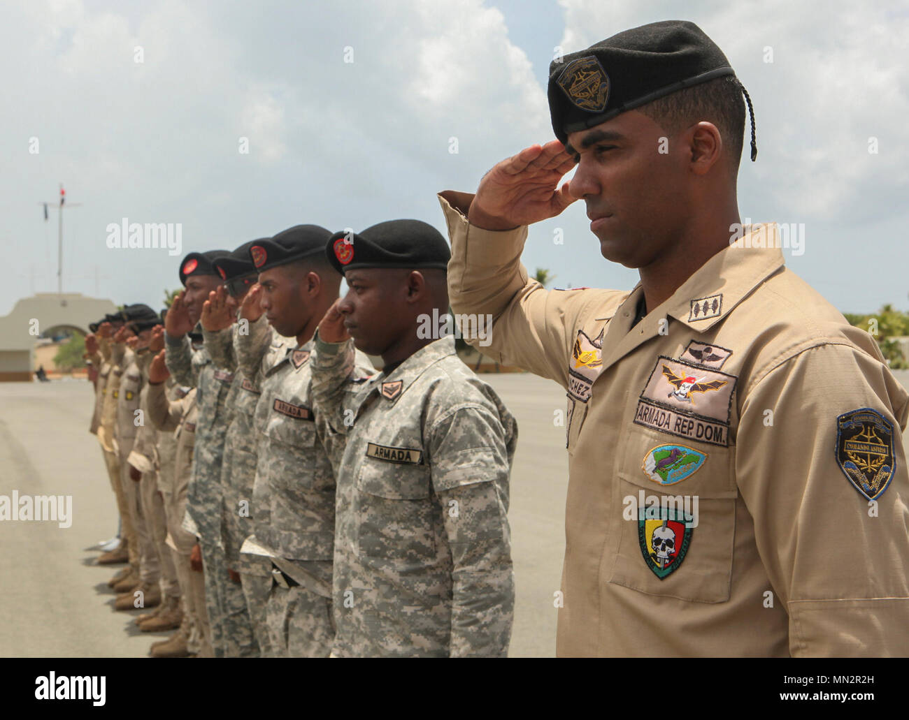 Dominican Navy commandos salute in formation during a graduation ...