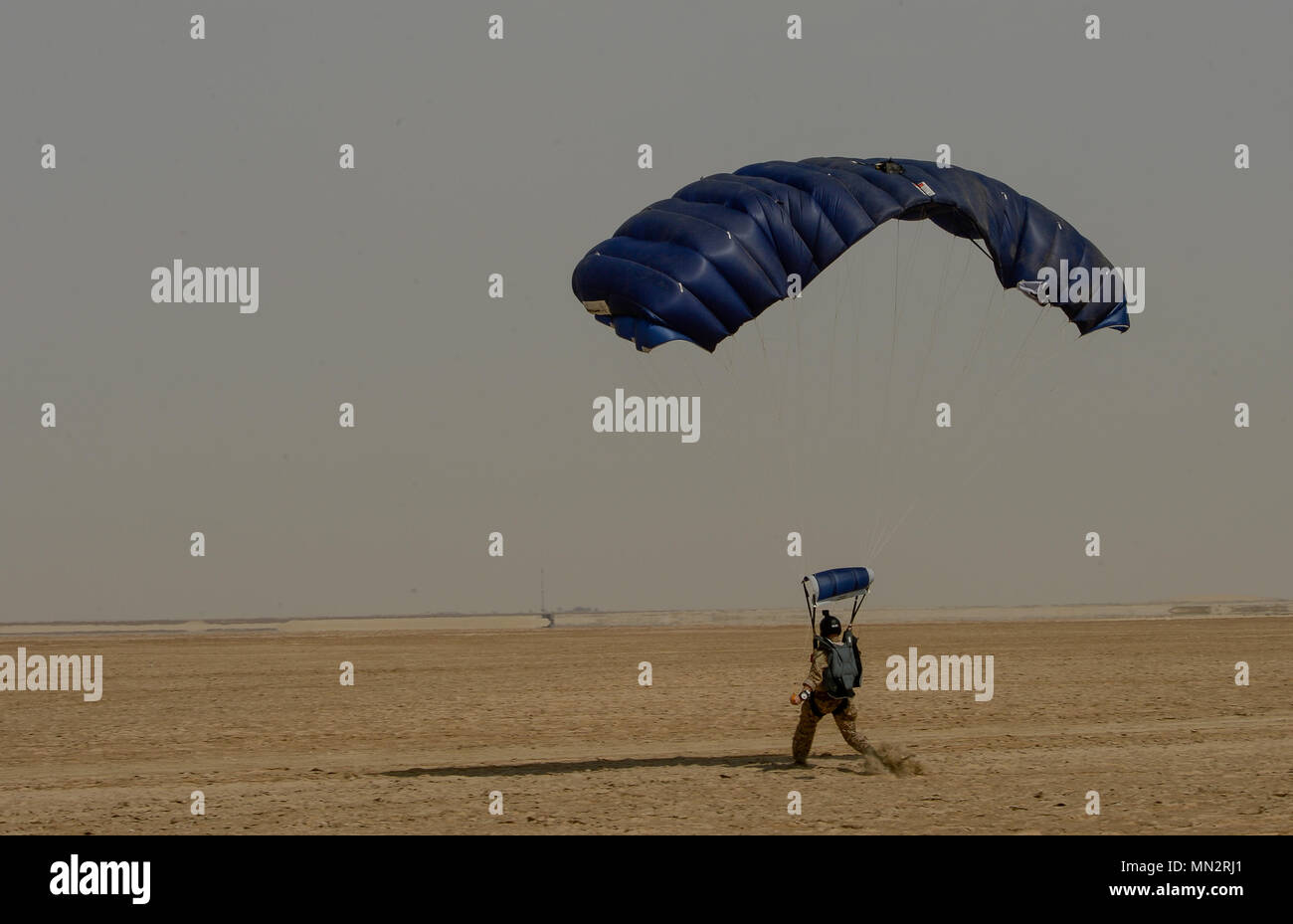 A U.S. service member lands after participating in a Friendship Jump ...