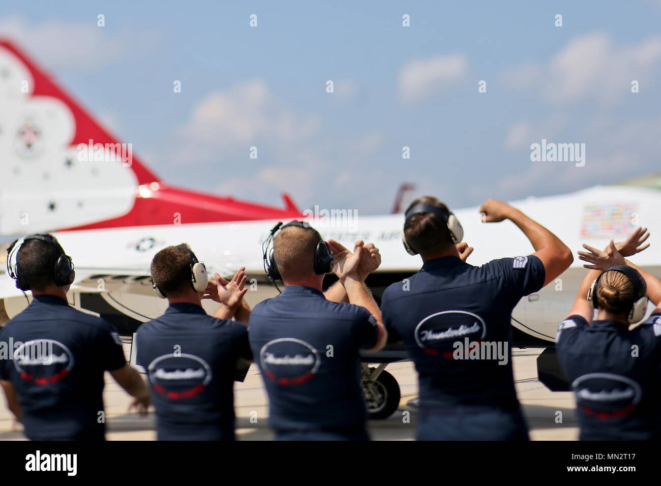 U.S. Air Force Thunderbirds maintenance airmen signal to Thunderbird #1 ...