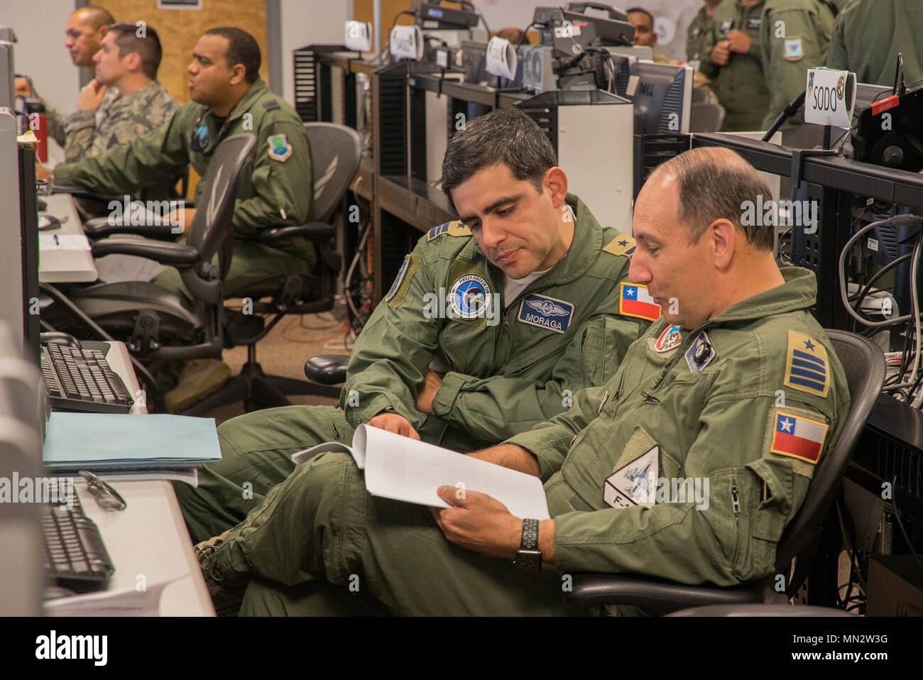 Service members from partner nation air forces work together during ...