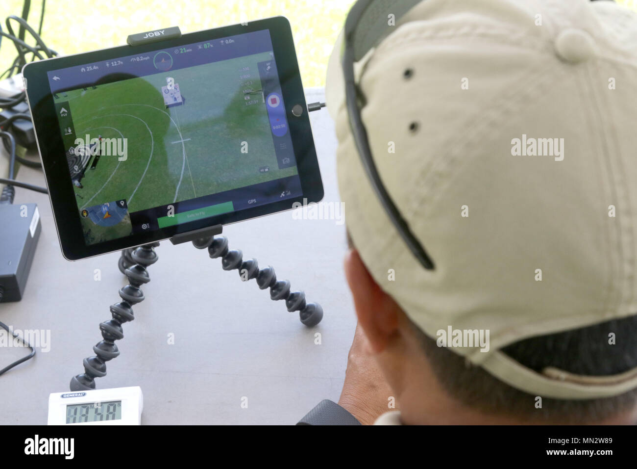 An operator pilots an unmanned aircraft through a test and evaluation ...