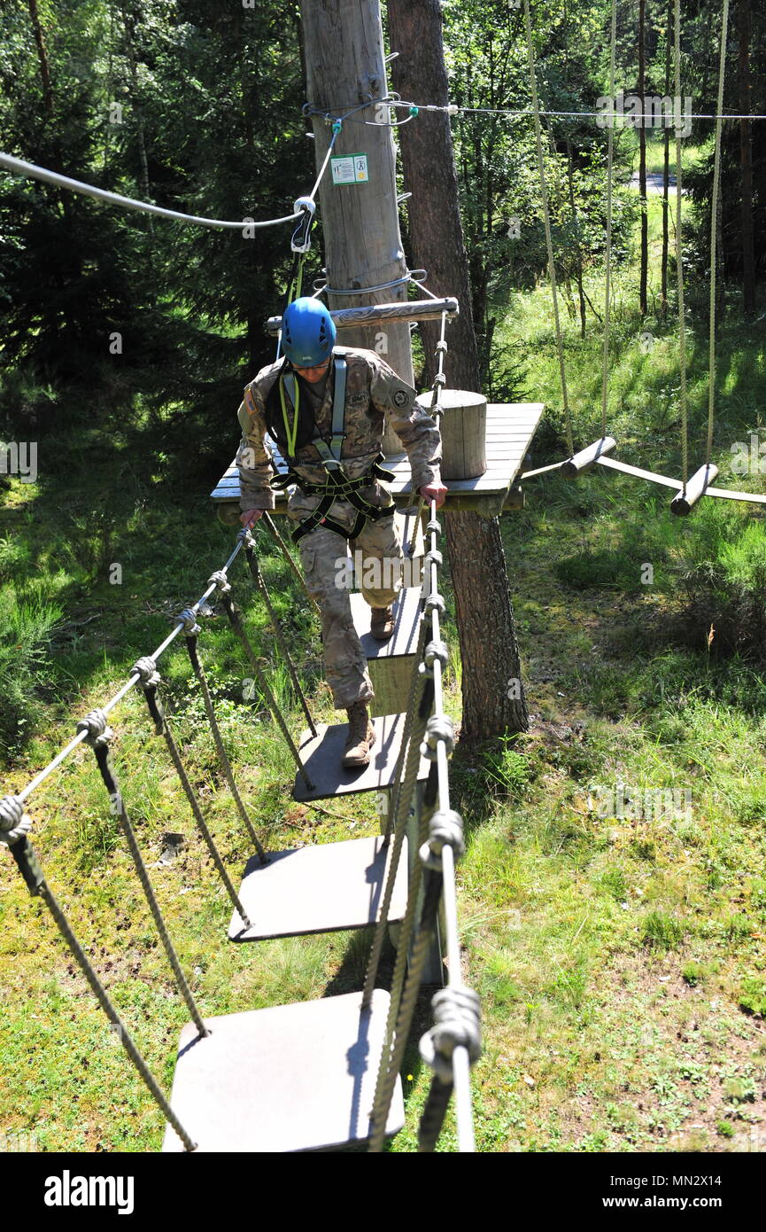 Cpl. Eric Melendez, 2nd Cavalry Regiment, crosses an obstacle on the ...