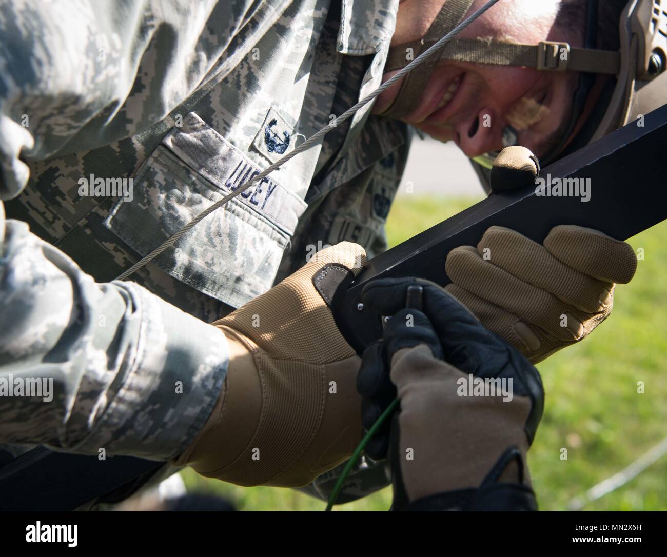 A U.S. Airman assigned to the 435th Security Forces Squadron helps ...
