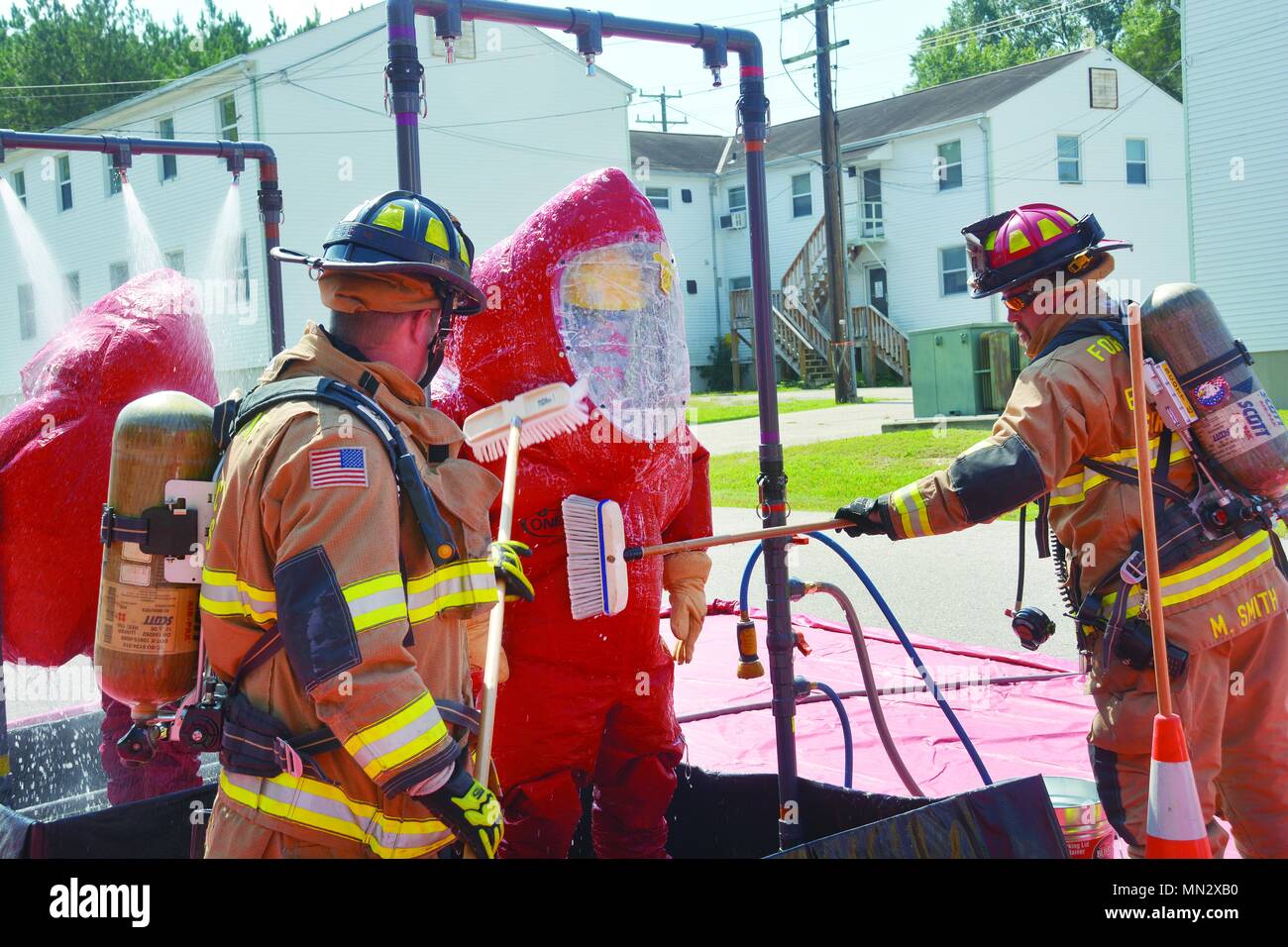 Firefighter Chris Mitchell (left) and Fire Capt. Mike Smith (right ...