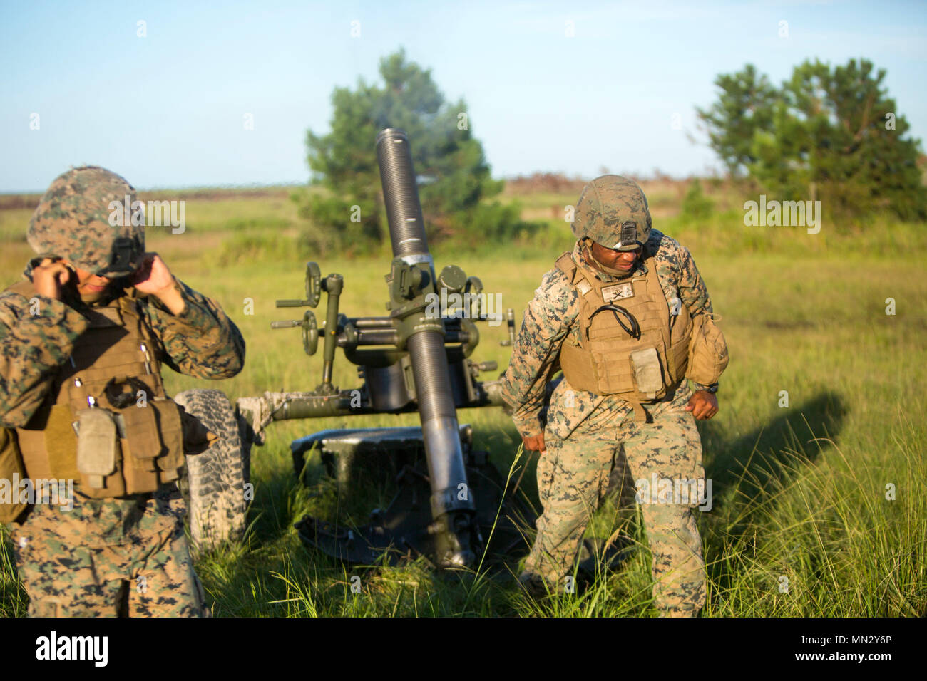 Sgt. Dave Simpson fires an M327 mortar during a live-fire training ...