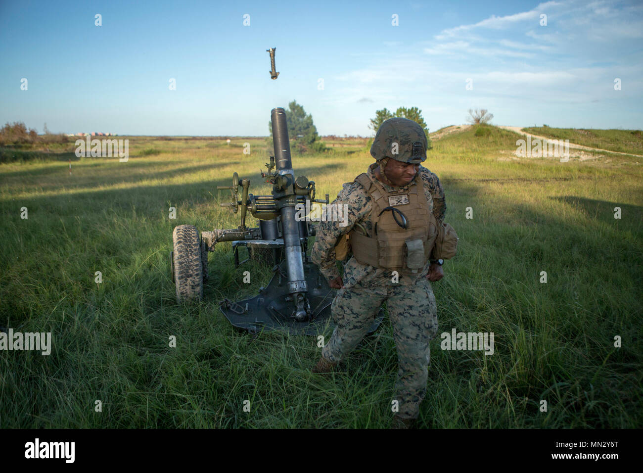 Sgt. Dave Simpson fires an M327 mortar during a live-fire training ...