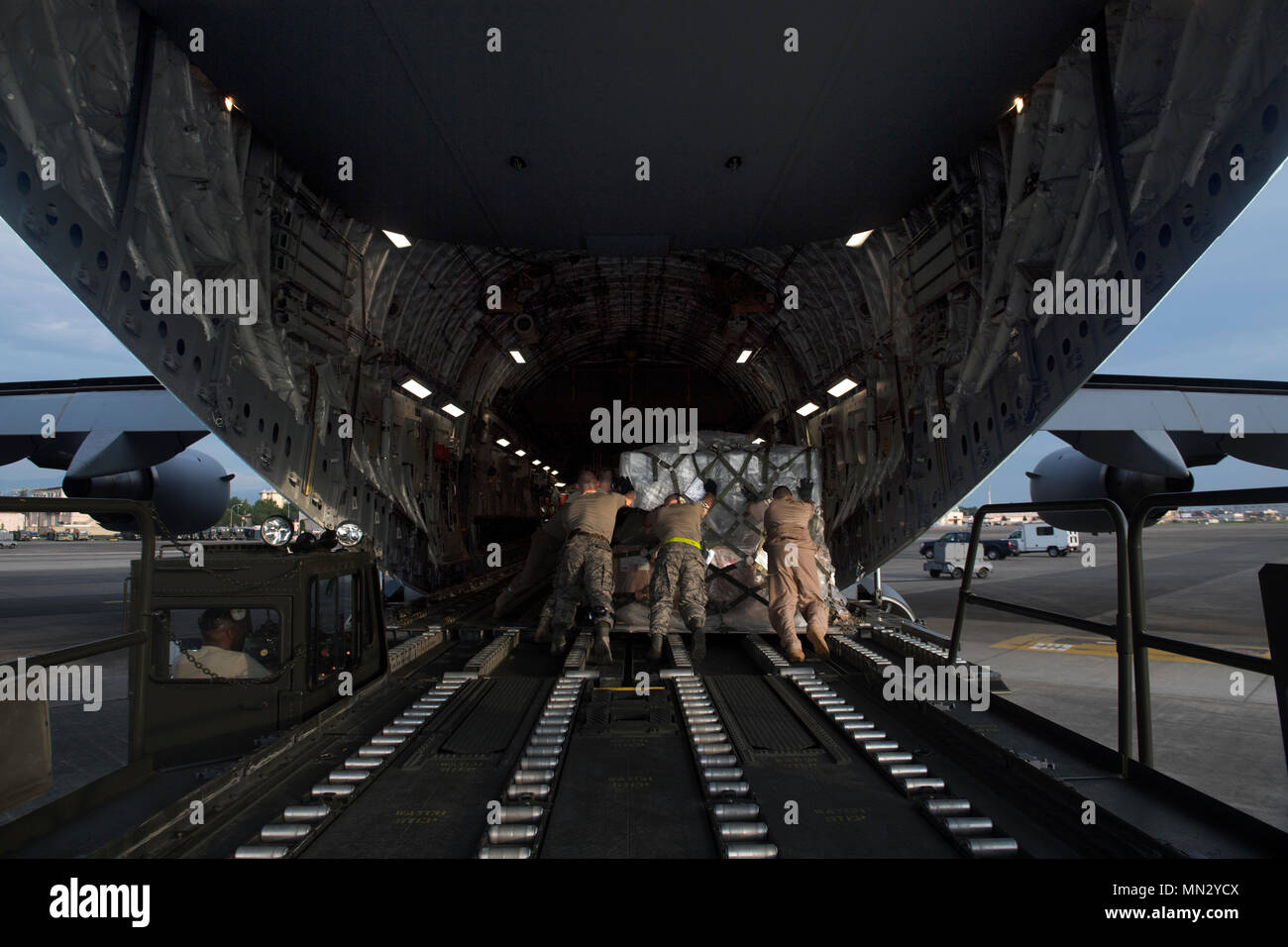 Airmen from the 730th Air Mobility Squadron and 204th Airlift Squadron ...