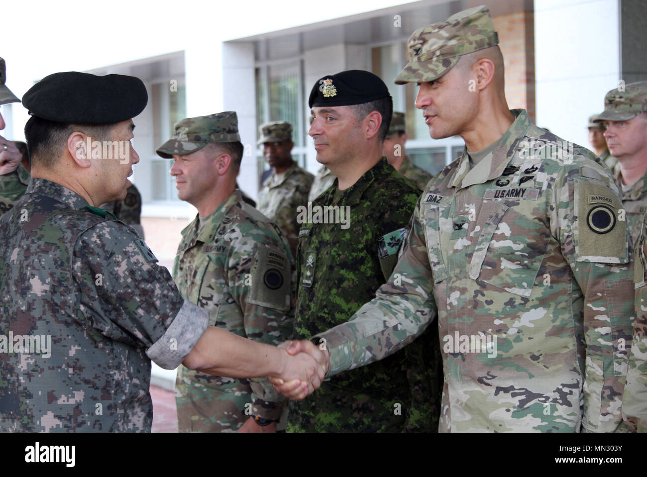 Gen. Woon-Young Kim, Third Republic of Korea commanding general, greets ...