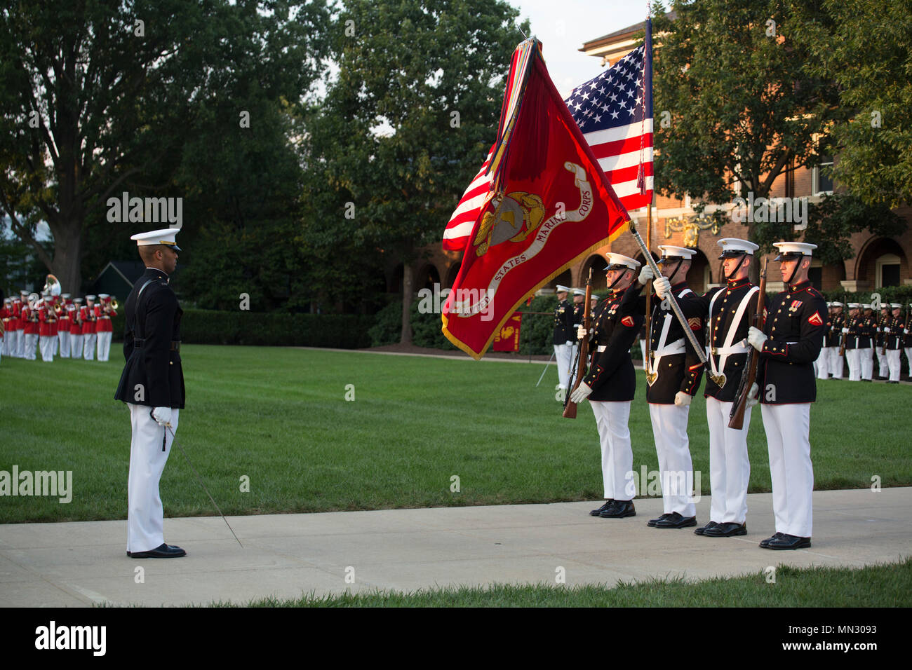 U.S. Marines with the official Marine Corps Color Guard present the ...