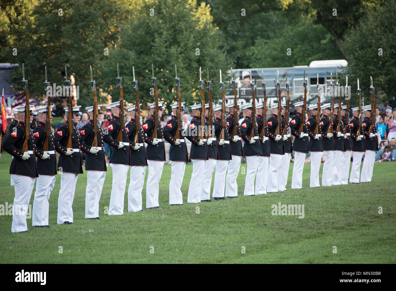 The Marine Corps Silent Drill Platoon performs during a sunset parade ...