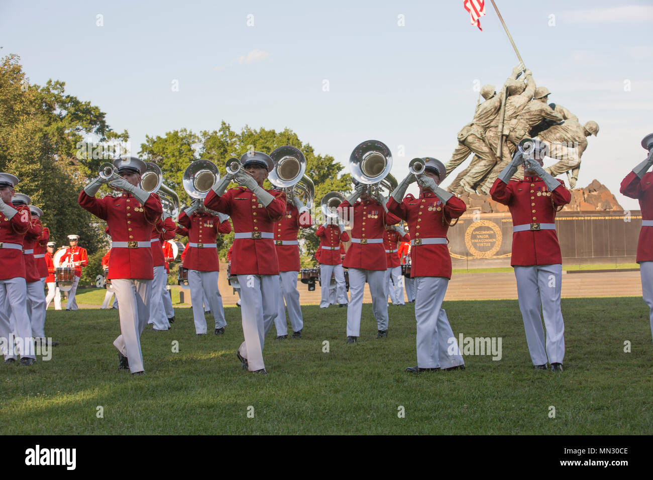 The U.S. Marine Drum and Bugle Corps performs during a sunset parade at ...