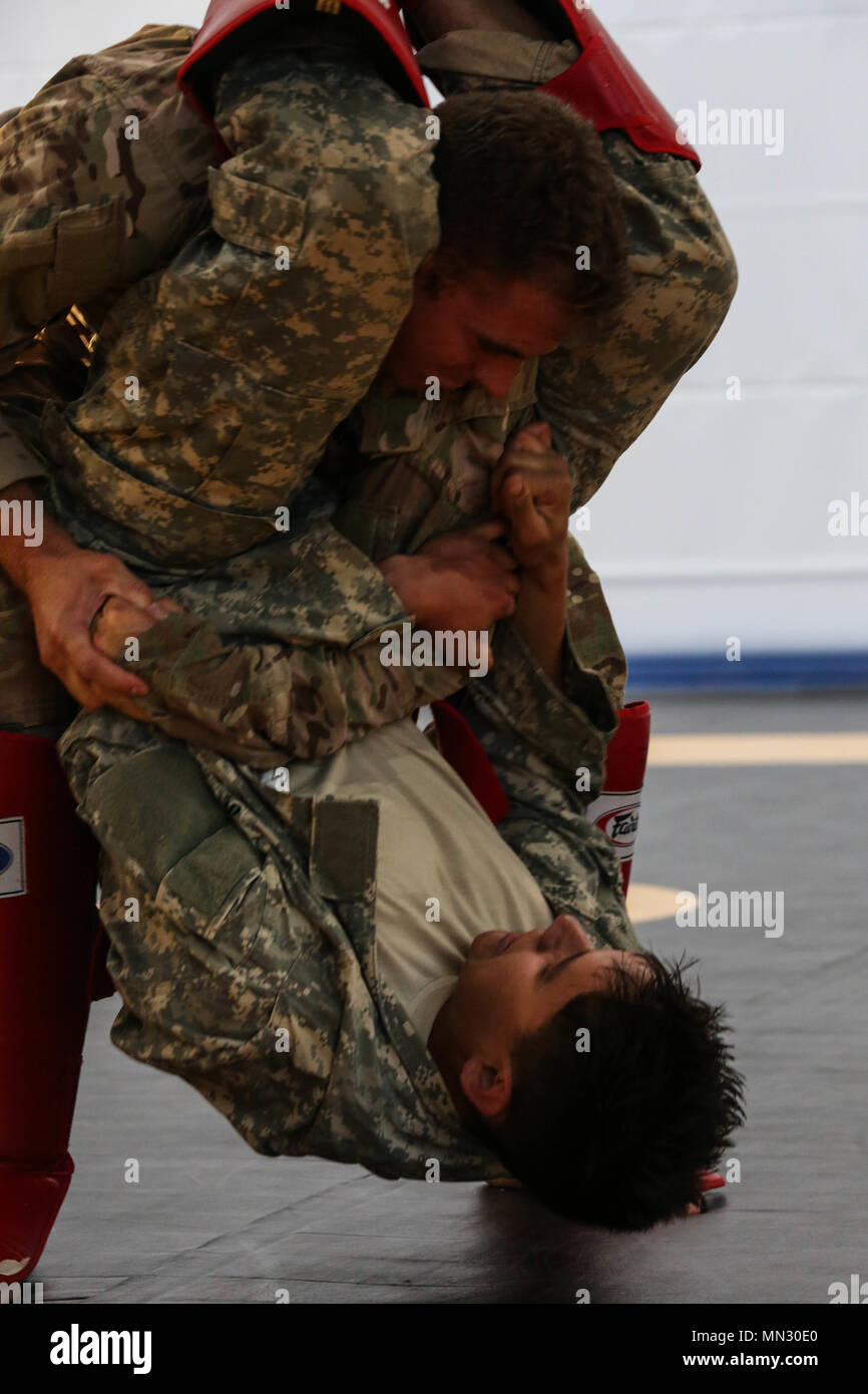 U.S. Army 1st Lt. Christopher Finseth, U.S. Army Africa, top, and Cpl ...
