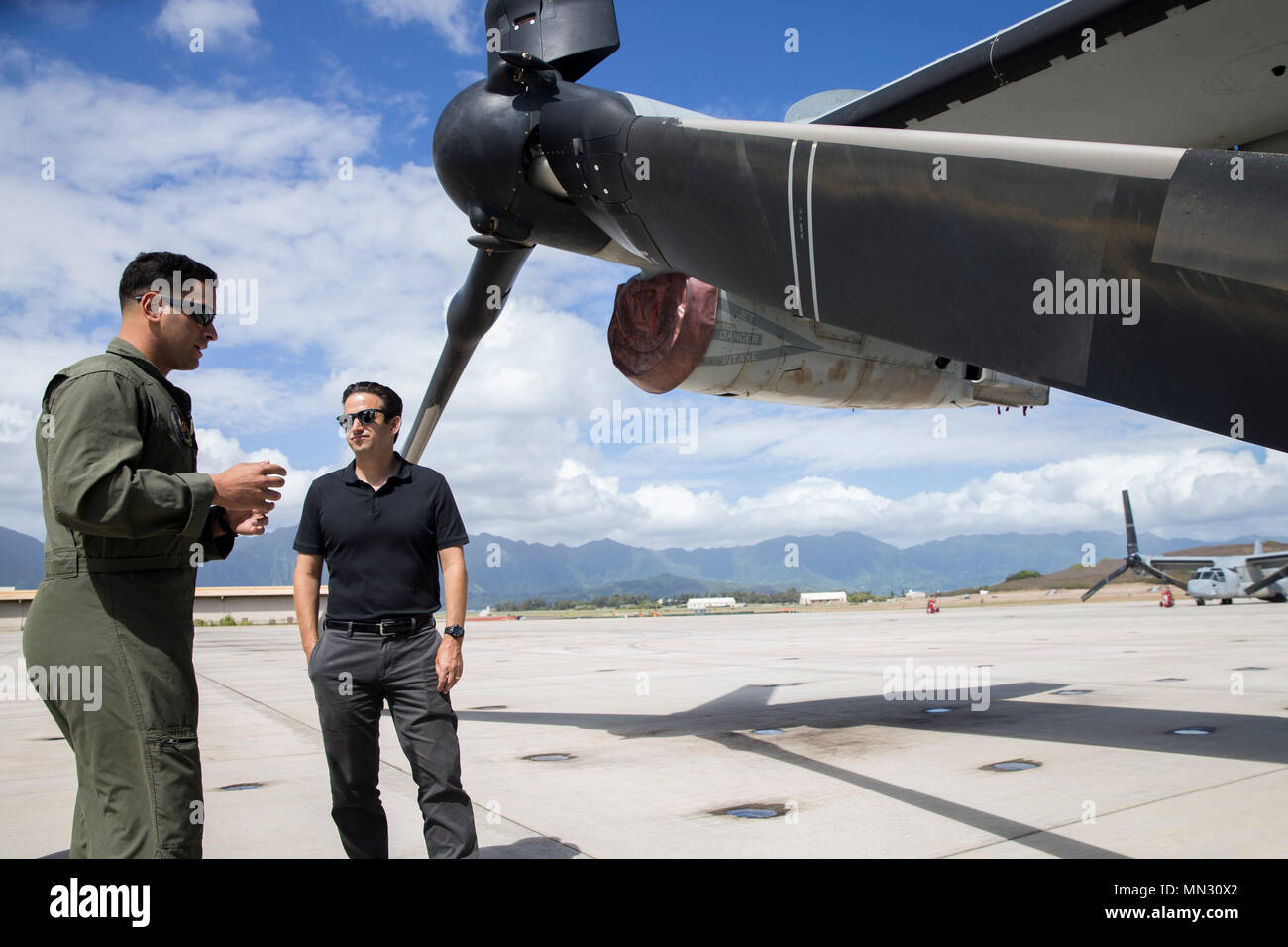 U.S. Senator Brian Schatz of Hawaii, speaks with Capt. Manuel Torres ...