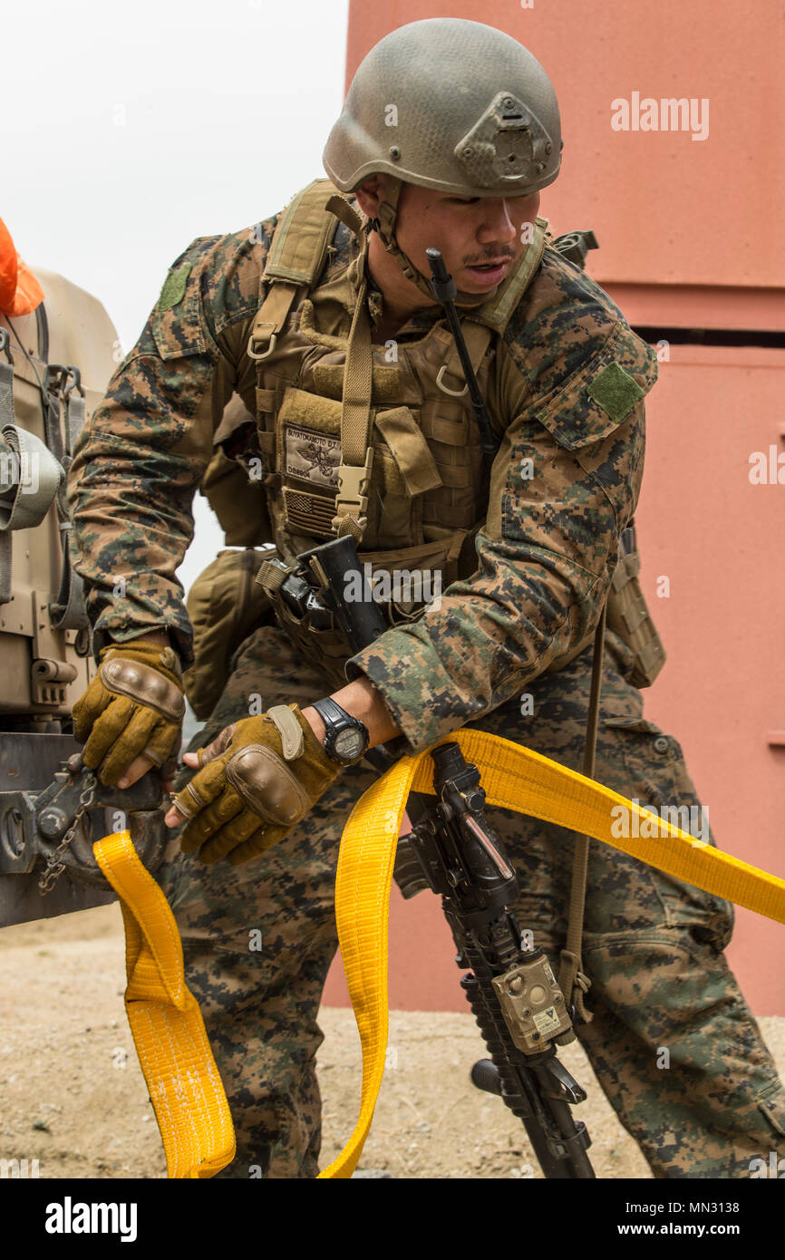 U.S. Marine Corps Sgt. David Suyatokamoto, a Fire Control Team Chief ...