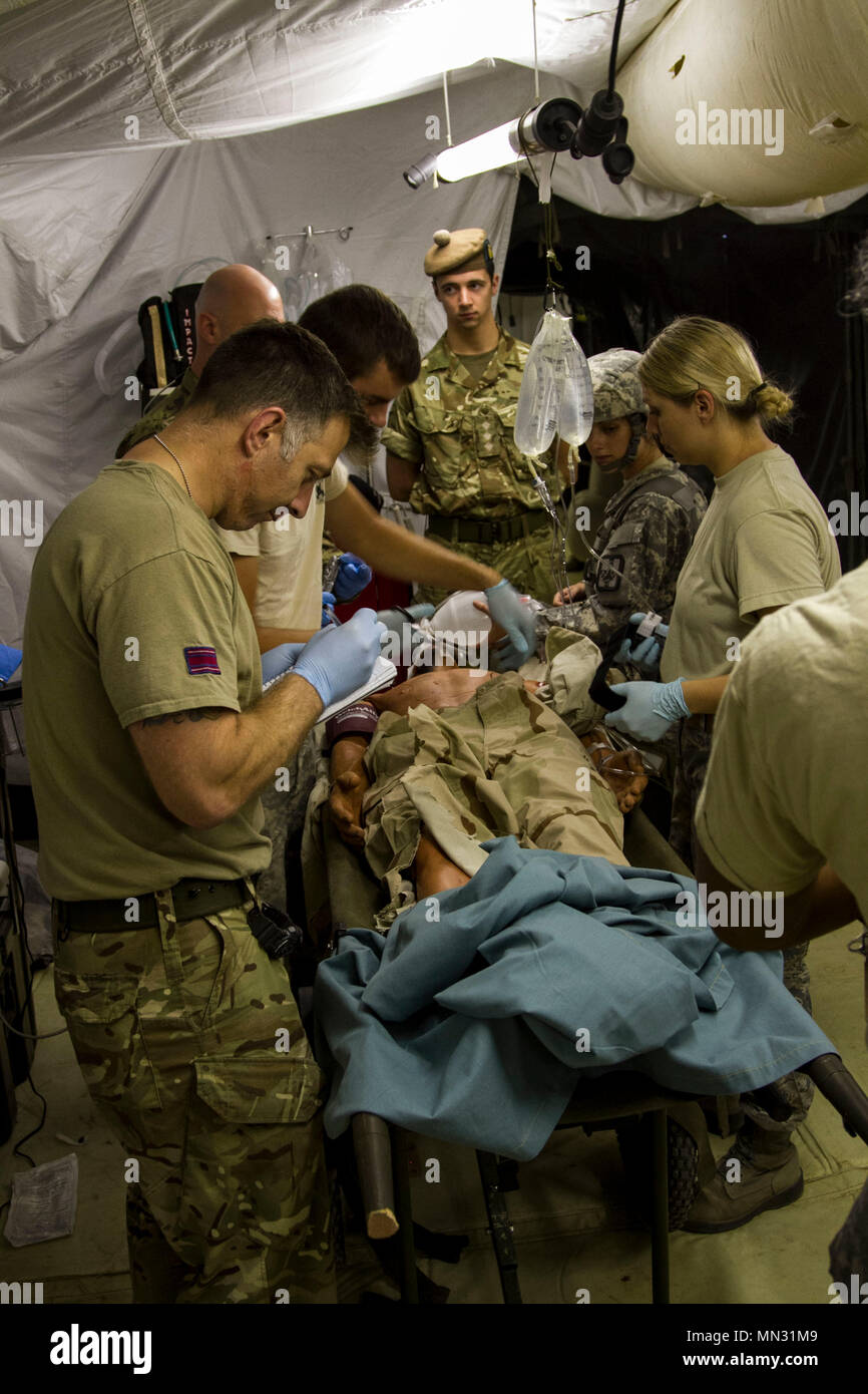 British Army Capt. Ryan Adams, center, of the 205 Scottish Field ...