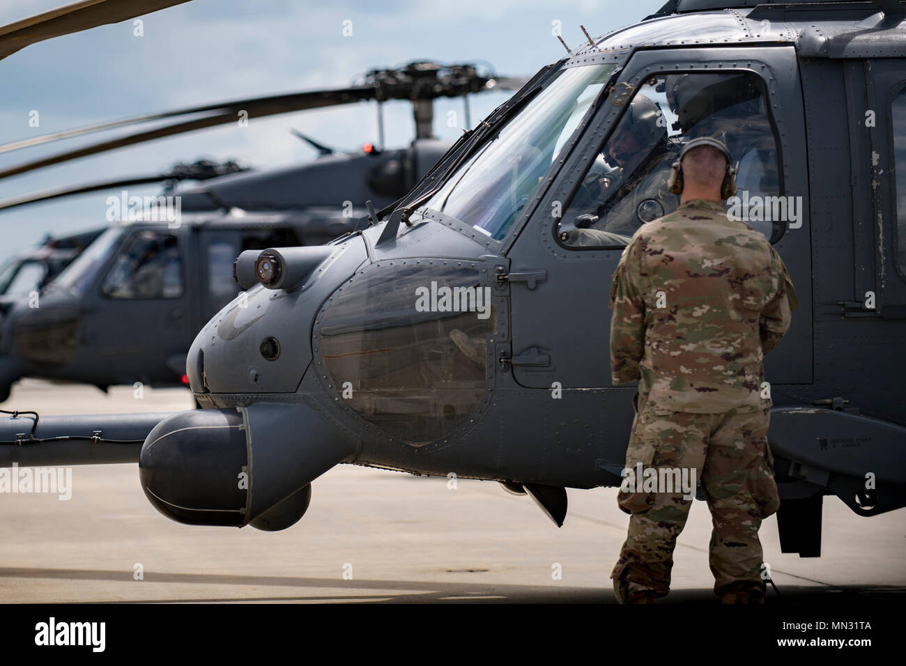 U.S. Air Force 41st Rescue Squadron HH-60G Pave Hawk crew members ...