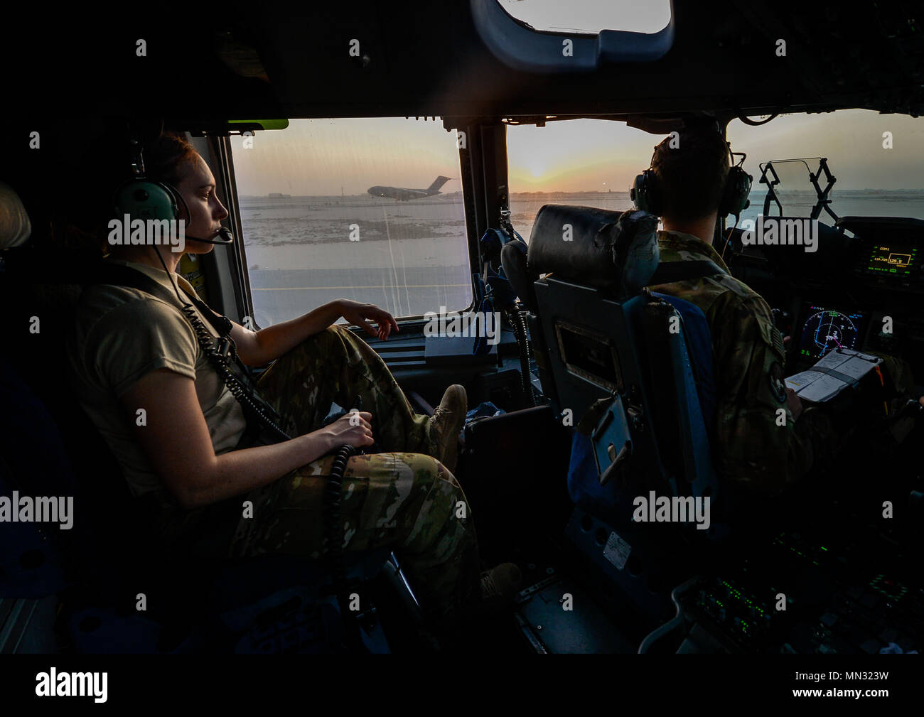 Airman 1st Class Elizabeth Silvers, left, 816th Expeditionary Airlift ...