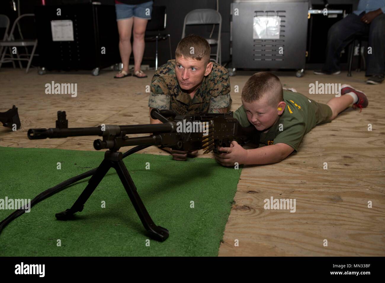U.S. Marine Corps Lance Cpl. Robert Coffey looks down range with his ...