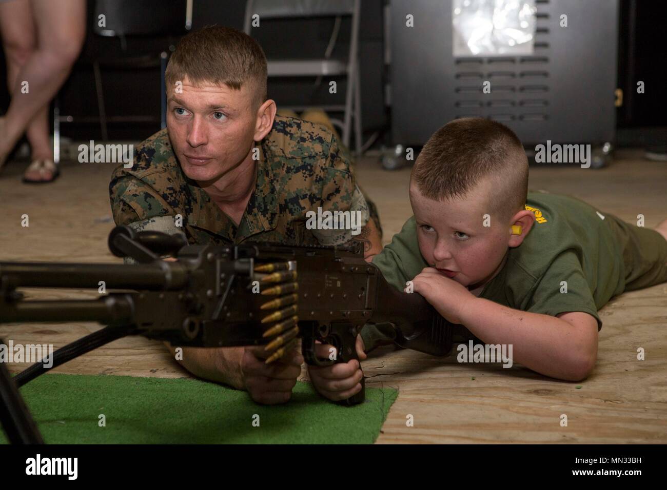 U.S. Marine Corps Lance Cpl. Robert Coffey looks down range with his ...