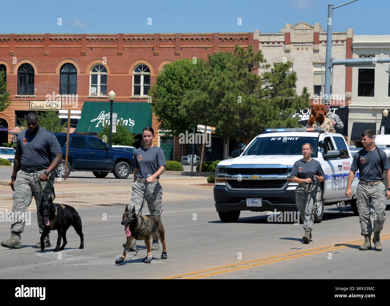 Members of the 97th Security Forces Squadron march with Military ...
