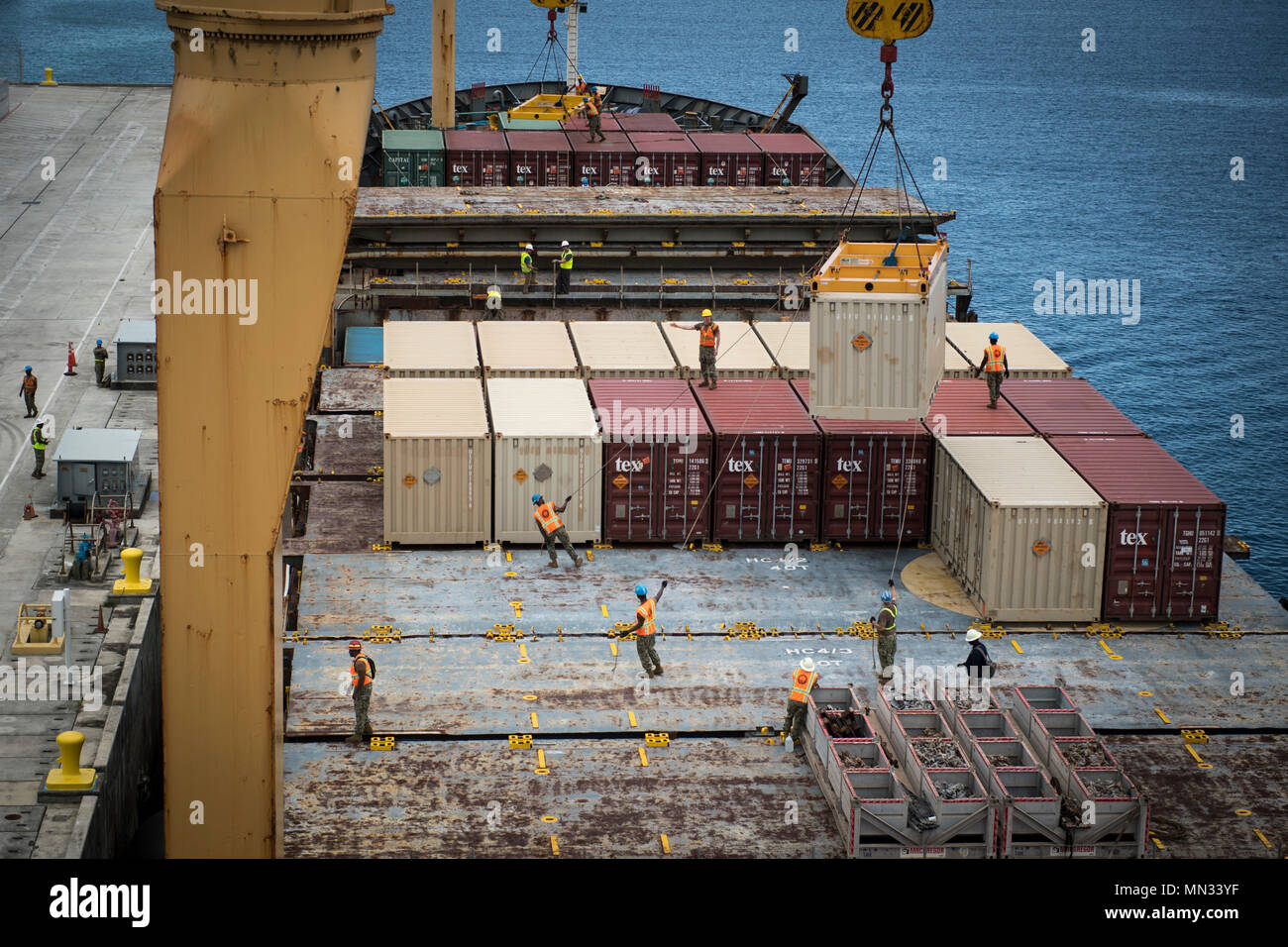 Sailors, assigned to Navy Cargo Handling Battalion ONE (NCHB-1) and ...