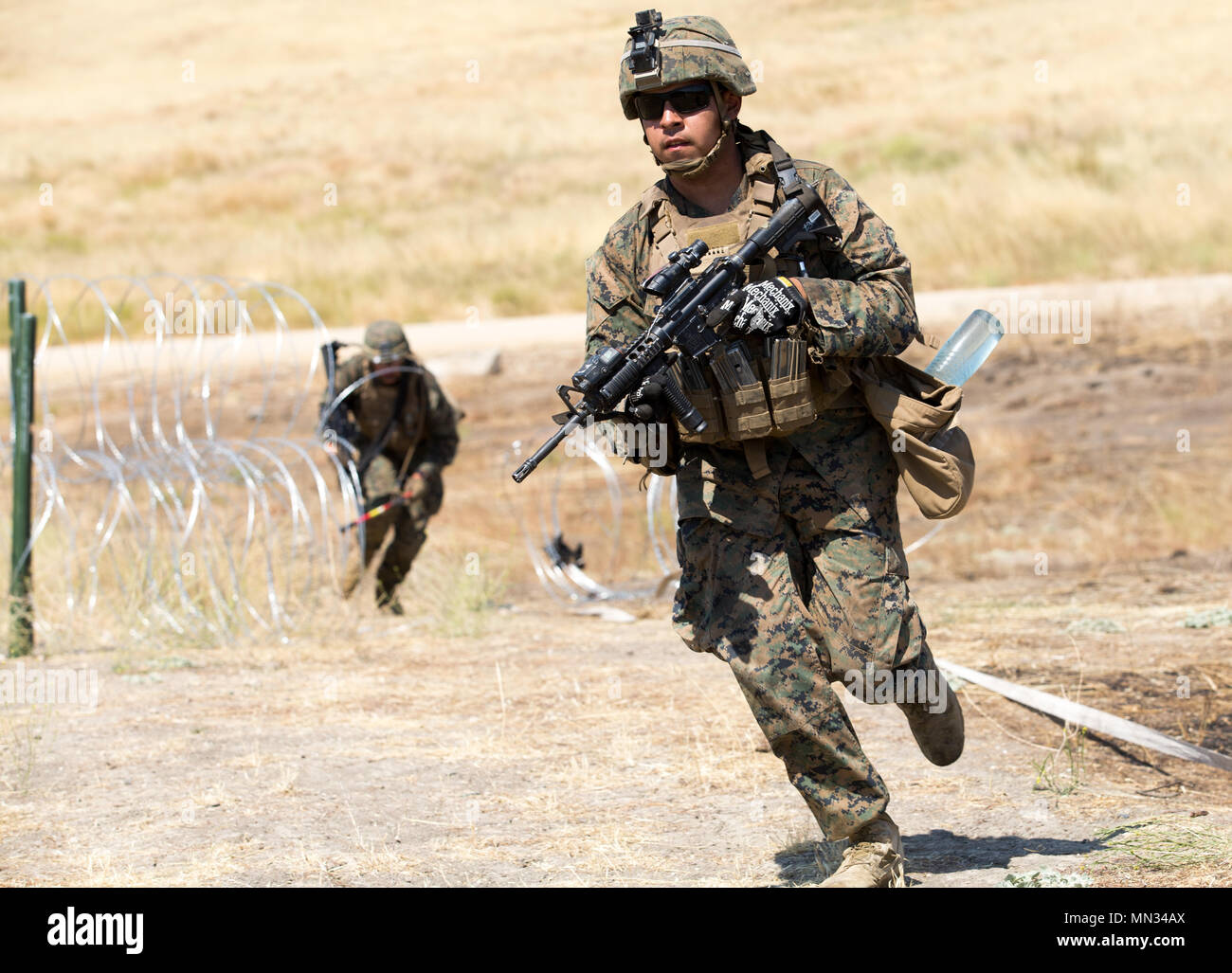 A U.S. Marine with 1st Combat Engineer Battalion (CEB) runs during a ...