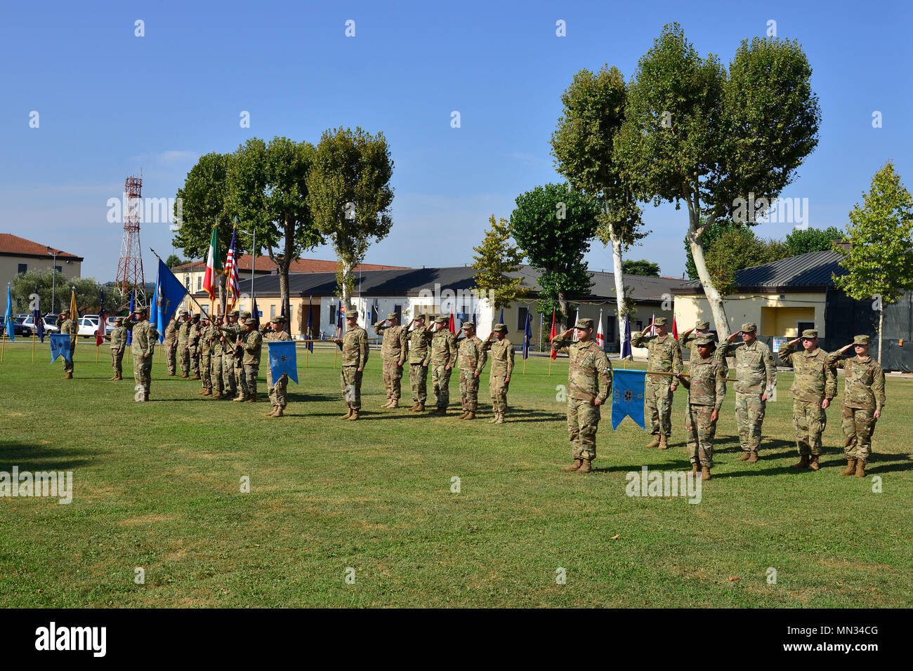 U. S. Army Soldiers from 307th Military Intelligence Battalion, salute during the playing of the ...