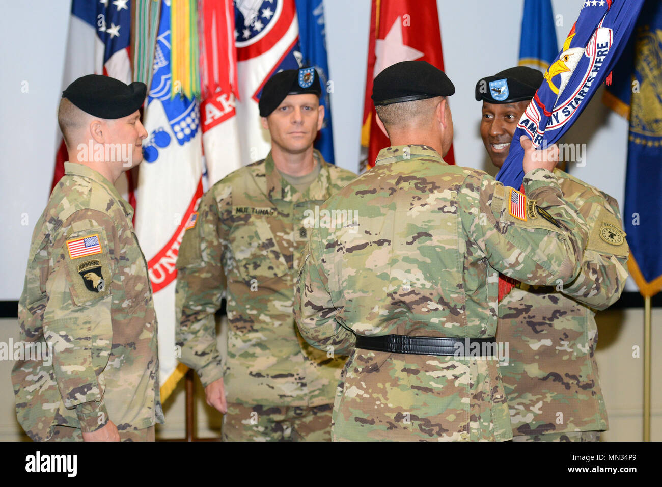 MG Jeffrey Snow (center) takes the battalion flag from outgoing ...