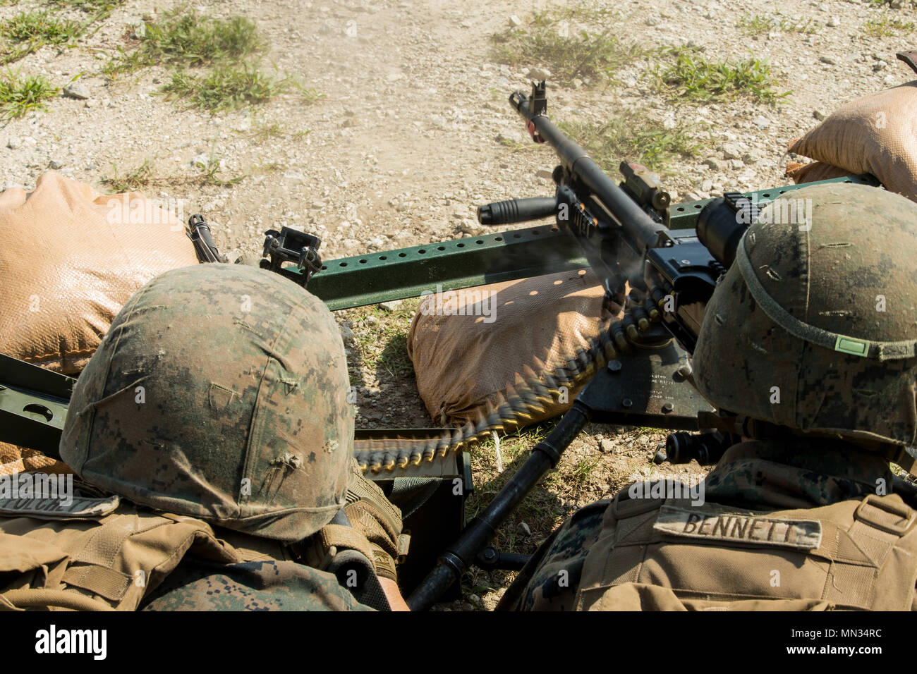 U.S. Marine Nicholas A. Bennett, right, a machine gunner with Battalion ...