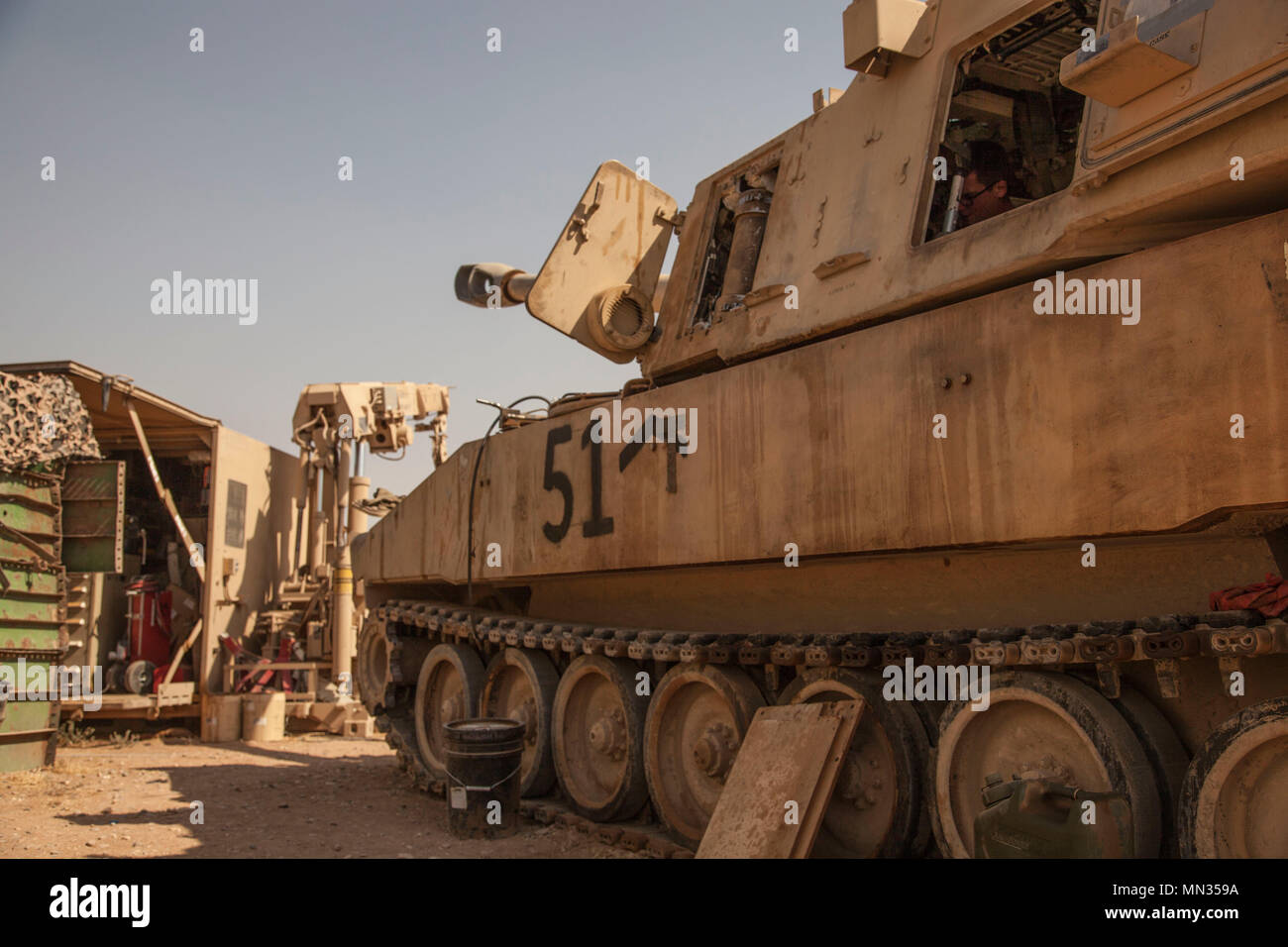 A U.S. Army M109A6 Paladin howitzer undergoes routine maintenance at a ...