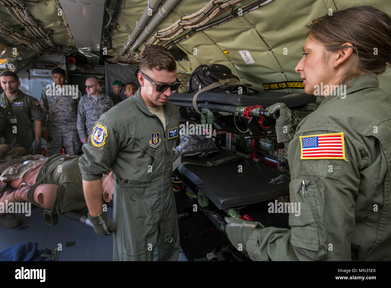 U.S. Air Force Staff Sgt. Ana Nichols, right, directs Airman 1st Class ...